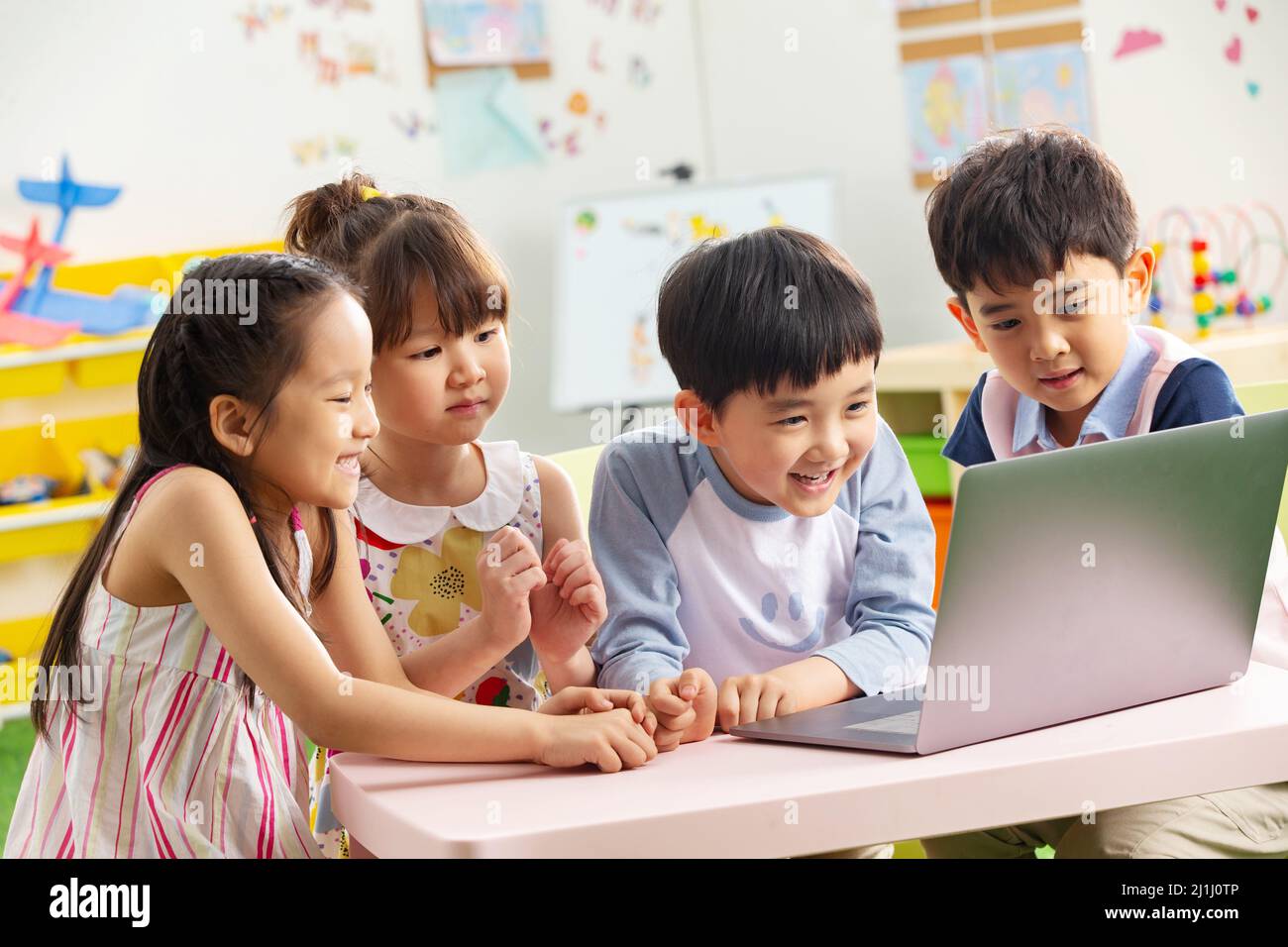 The kindergarten children watch video Stock Photo - Alamy