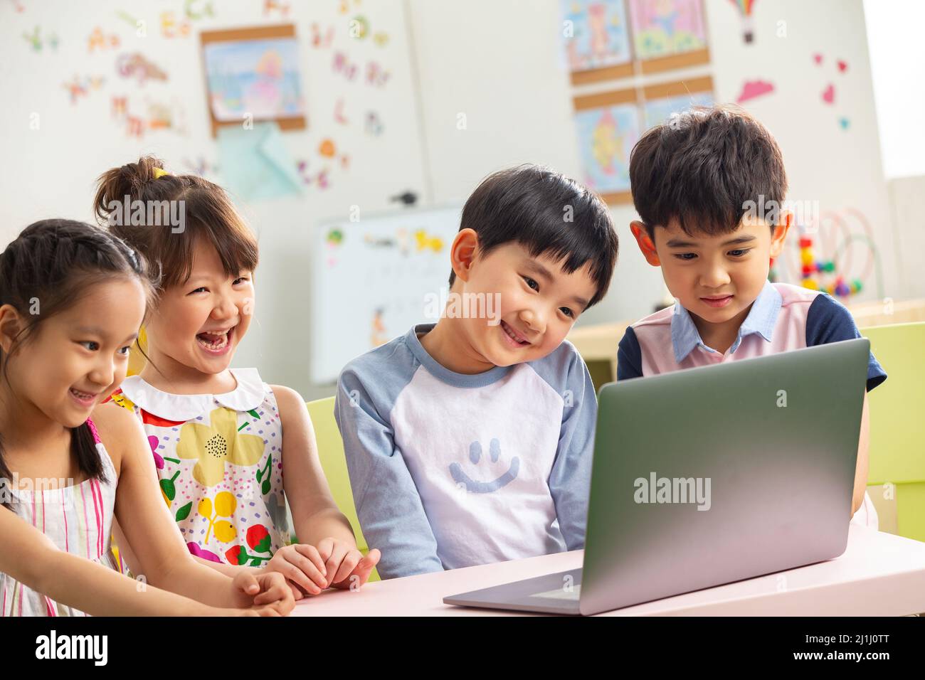 The kindergarten children watch video Stock Photo - Alamy