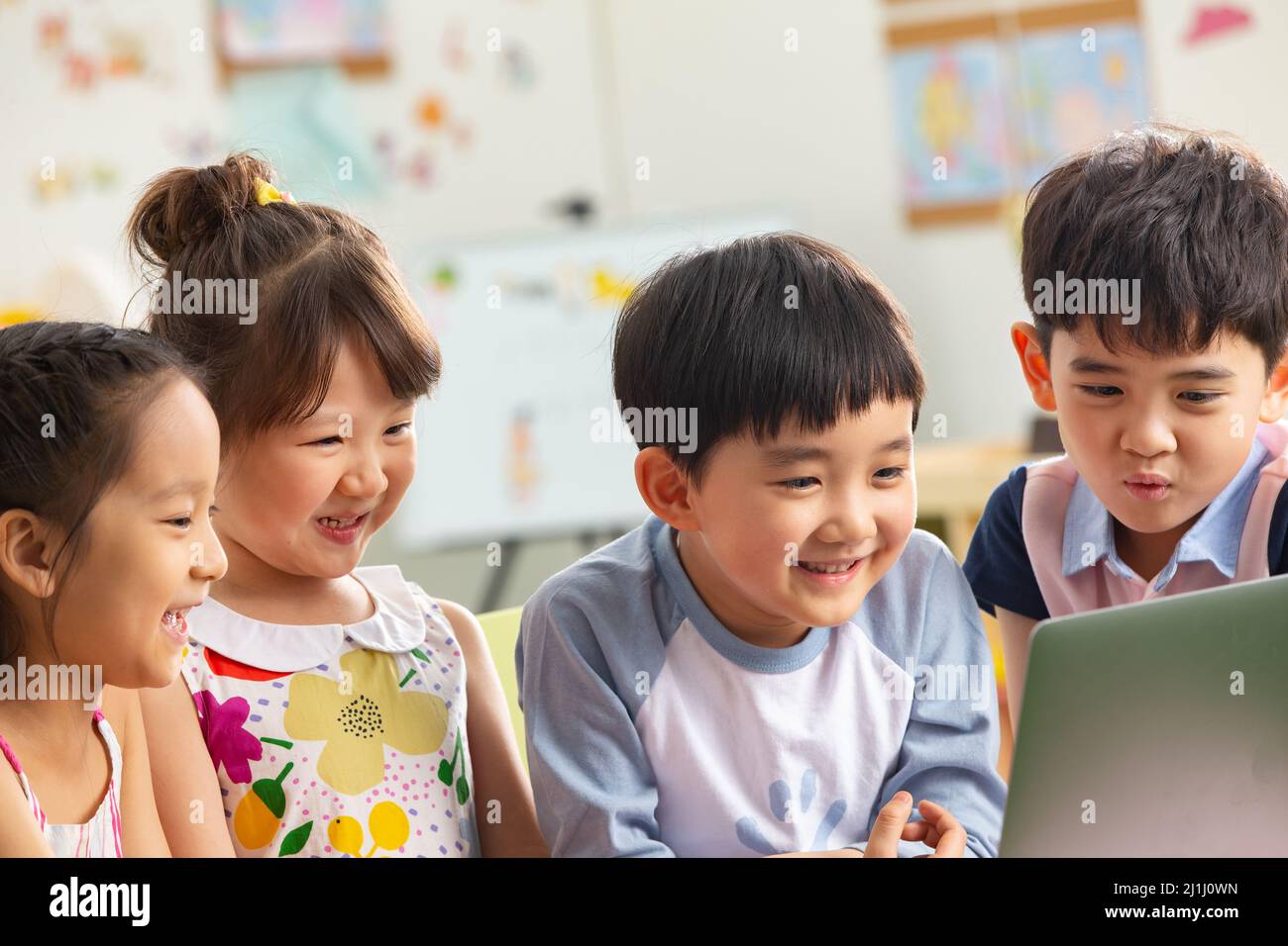 The kindergarten children watch video Stock Photo - Alamy