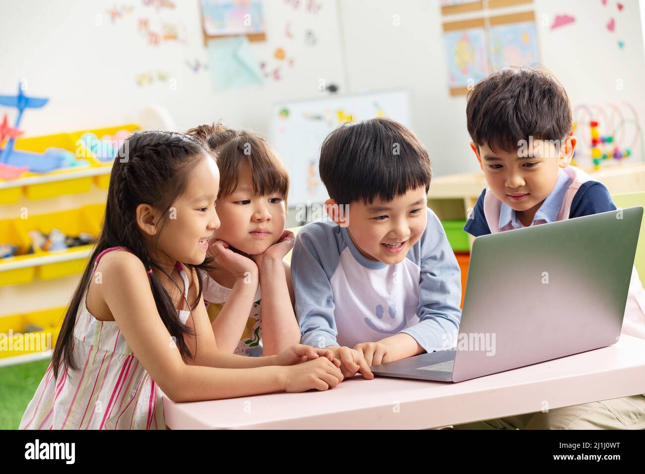 The kindergarten children watch video Stock Photo - Alamy