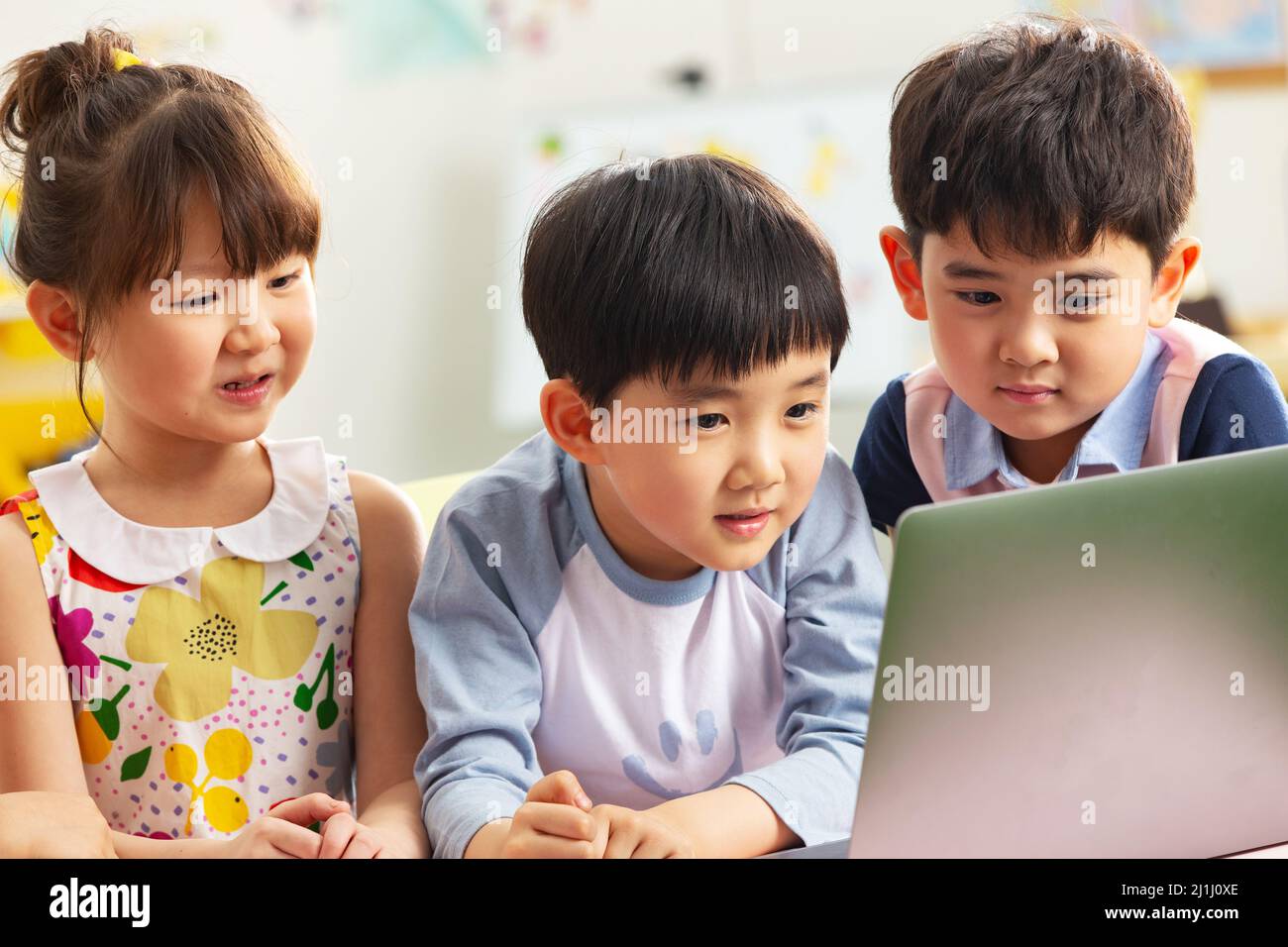 The kindergarten children watch video Stock Photo - Alamy