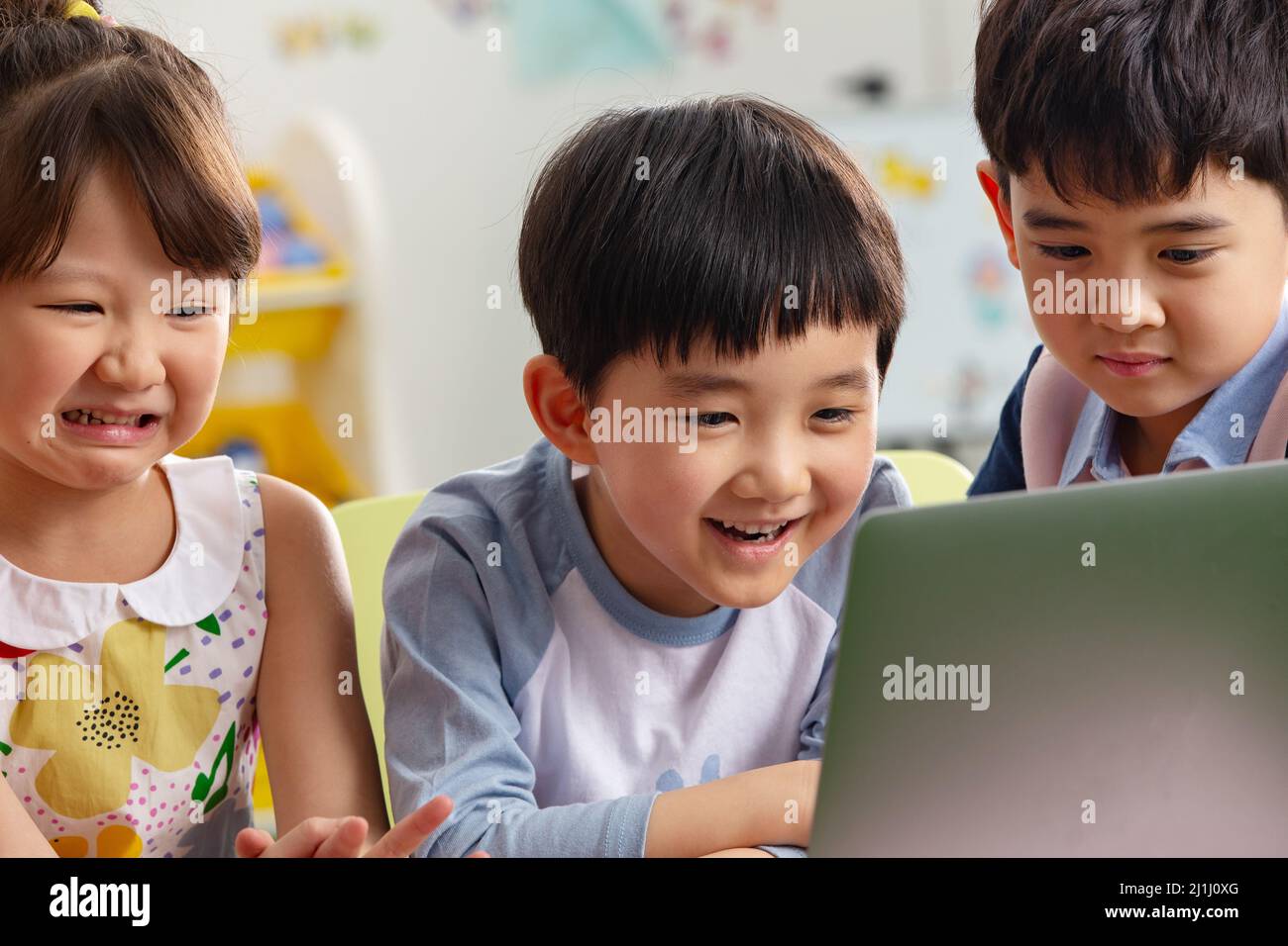The kindergarten children watch video Stock Photo - Alamy