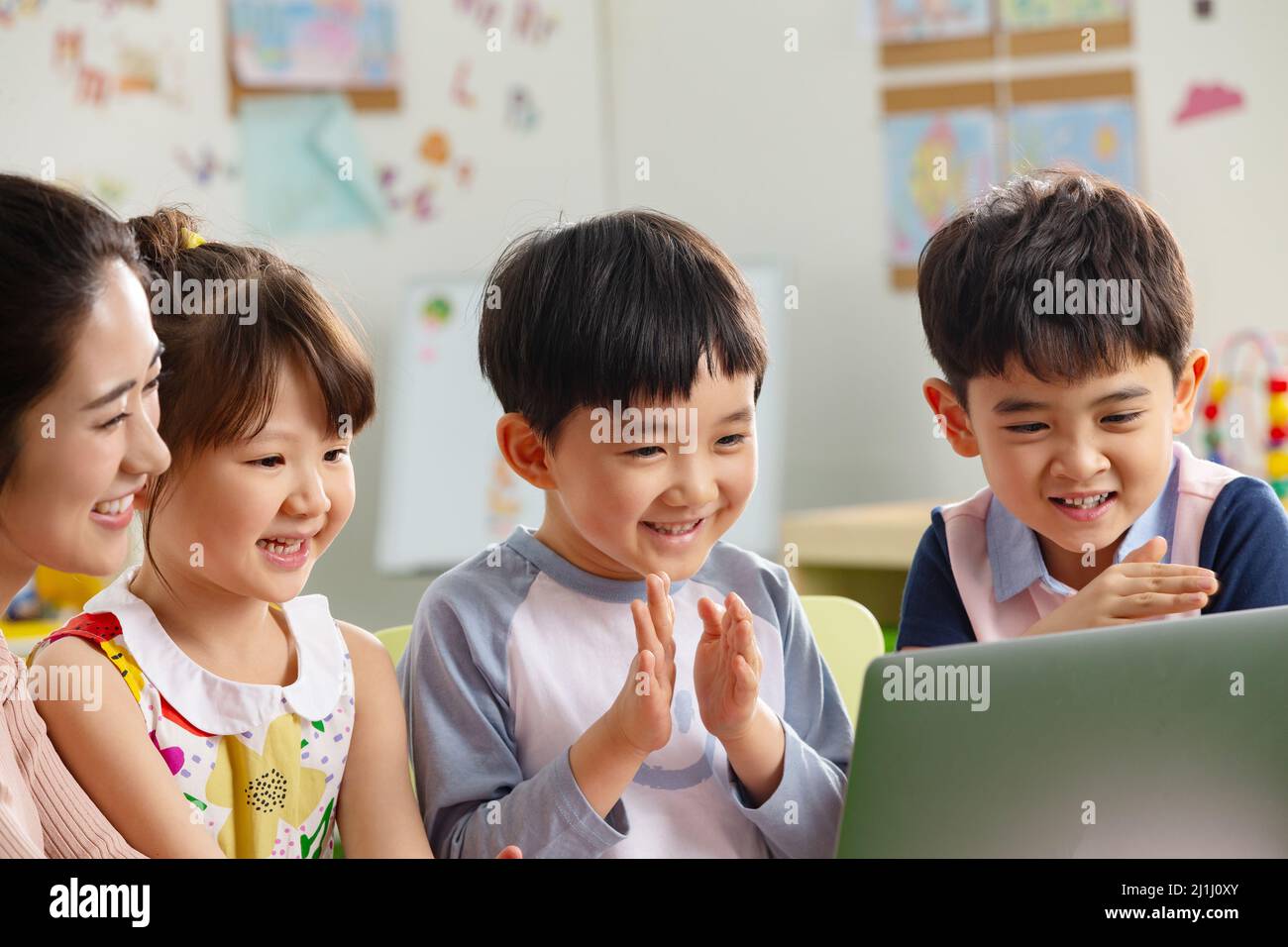 The kindergarten children watch video Stock Photo - Alamy