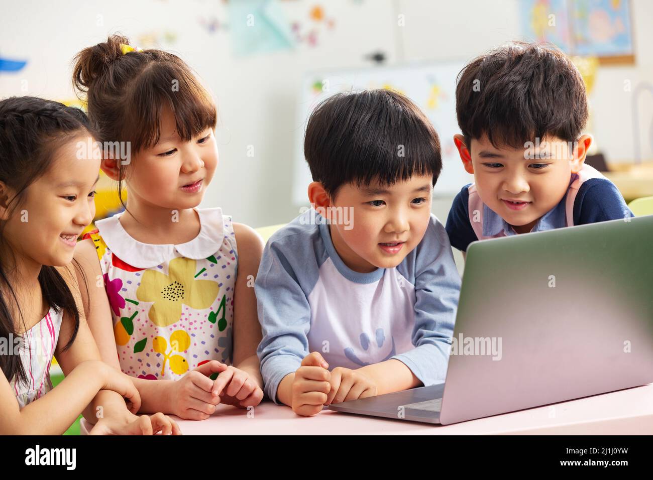 The kindergarten children watch video Stock Photo - Alamy