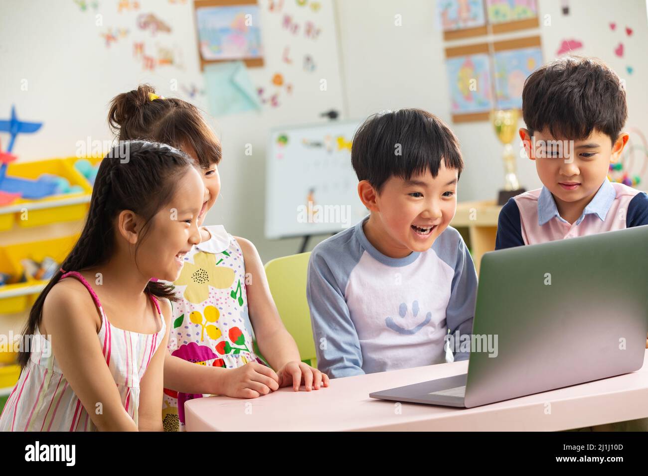 The kindergarten children watch video Stock Photo - Alamy