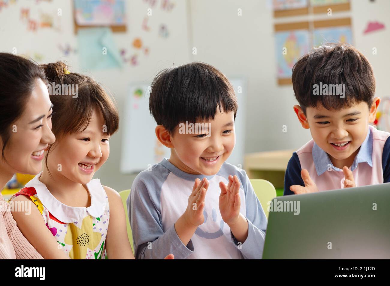 The kindergarten children watch video Stock Photo - Alamy