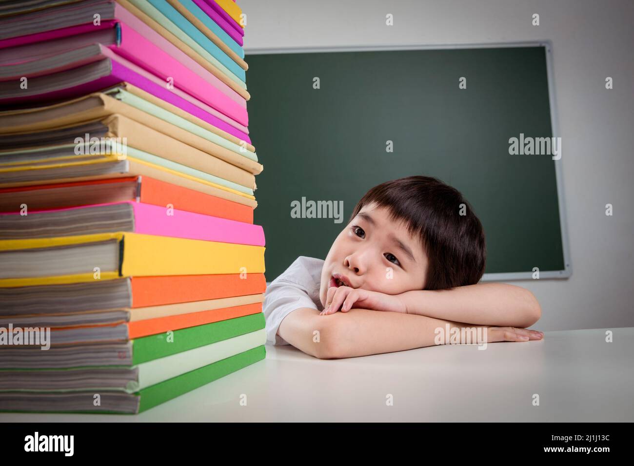 Primary school students and textbooks Stock Photo - Alamy