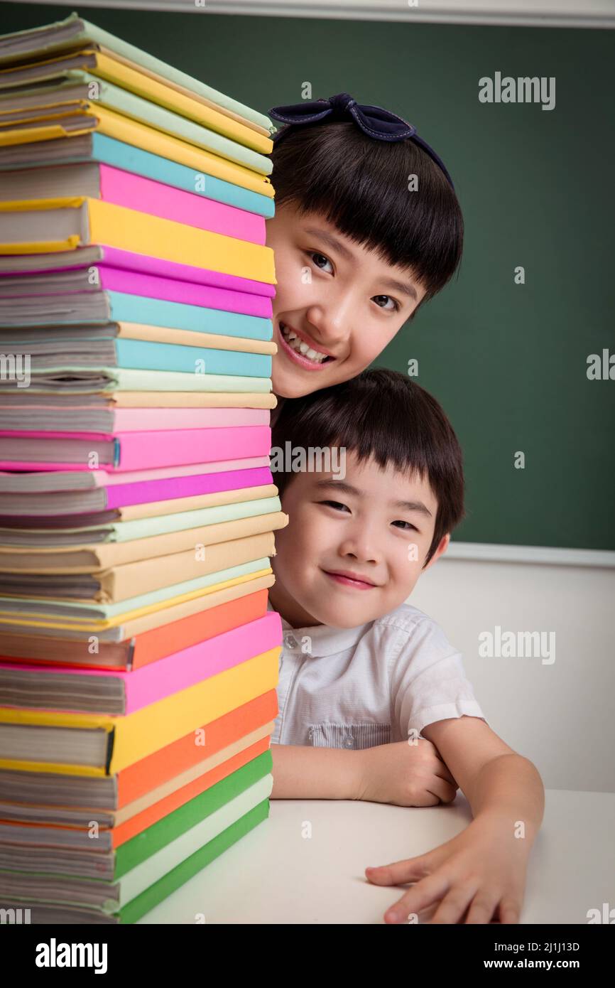 Primary school students and textbooks Stock Photo - Alamy