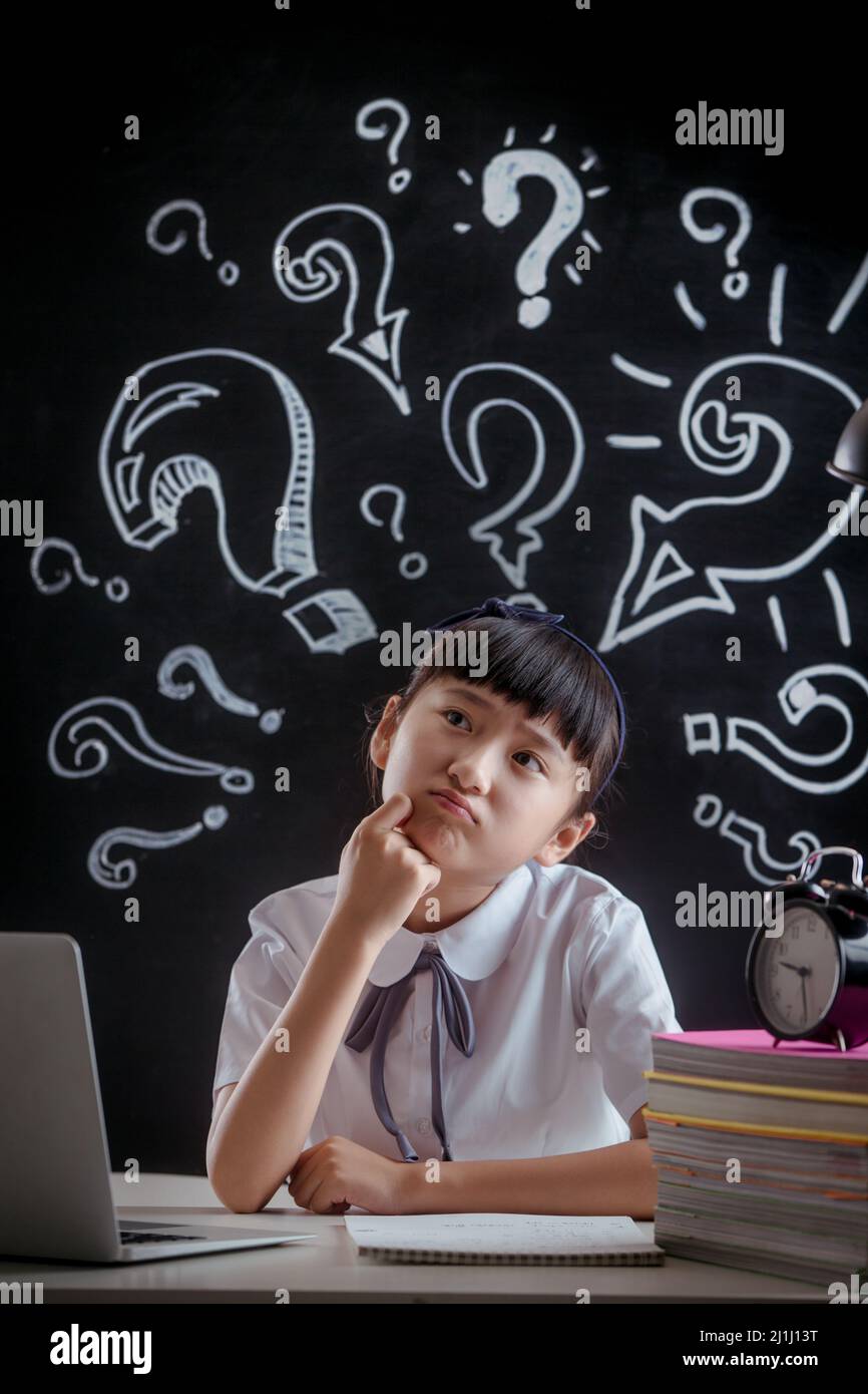 Primary school girls in thinking Stock Photo - Alamy