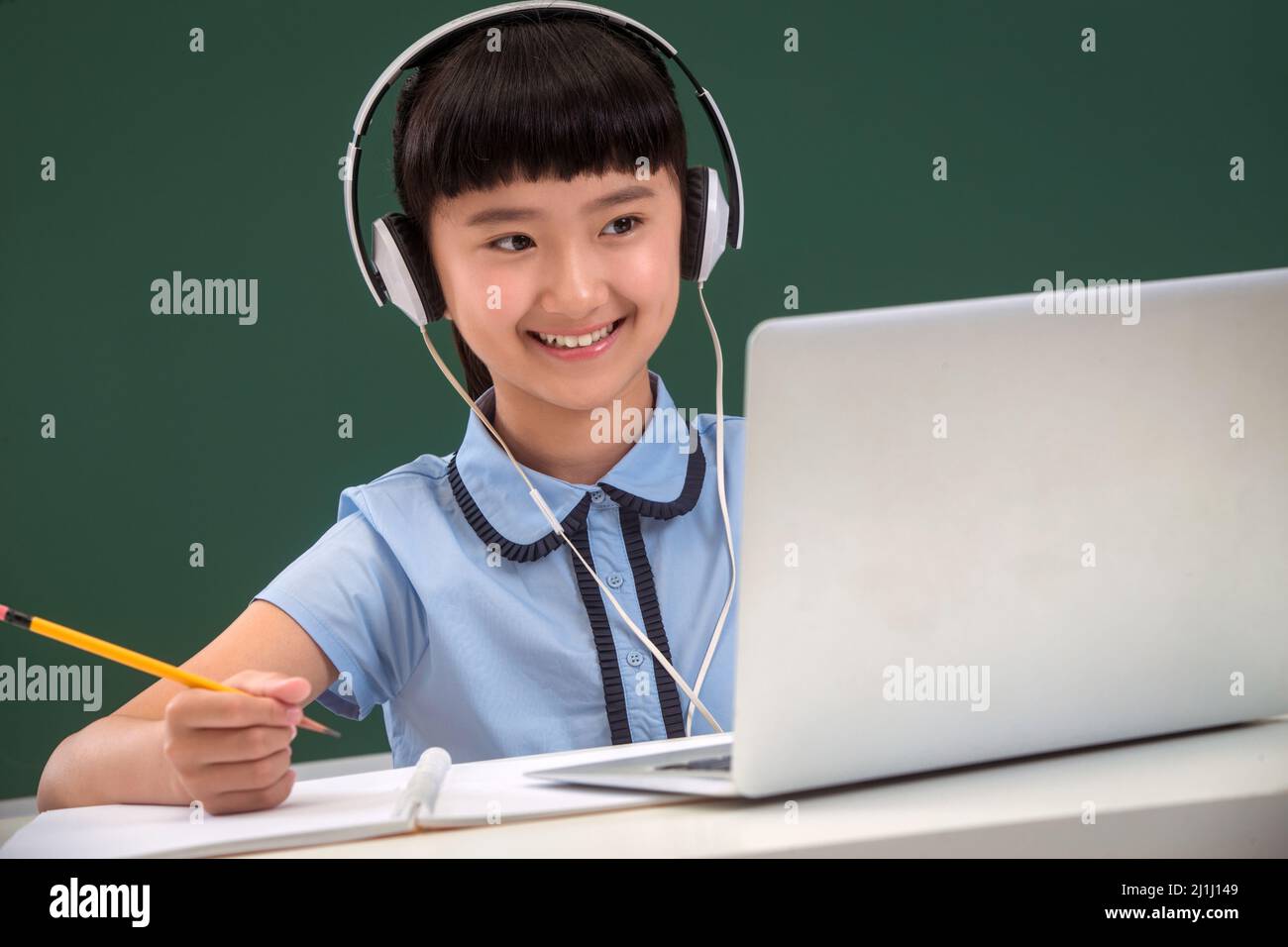 Primary school girls online learning Stock Photo - Alamy