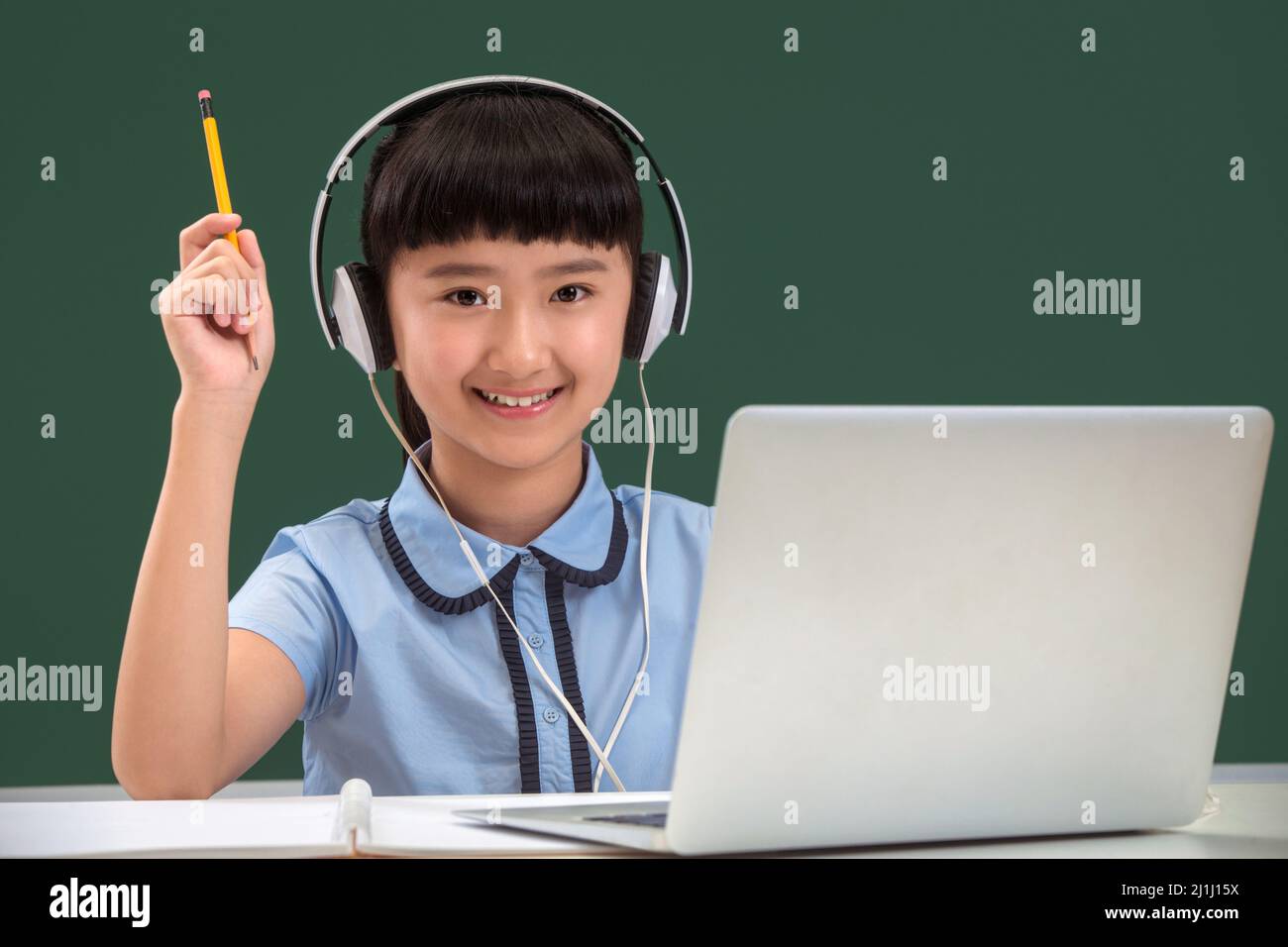 Primary school girls online learning Stock Photo - Alamy