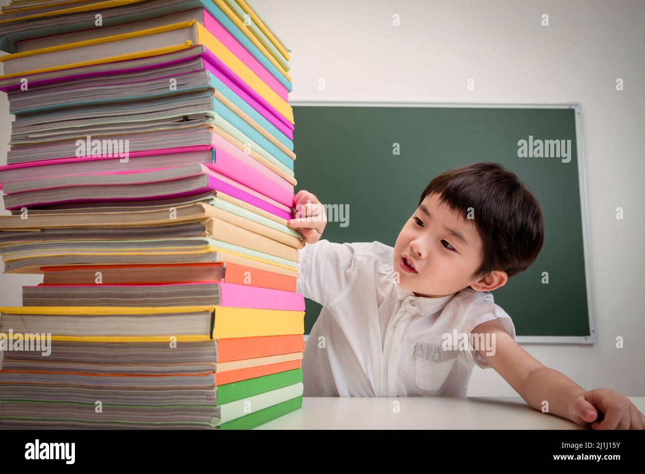 Primary school students and textbooks Stock Photo - Alamy