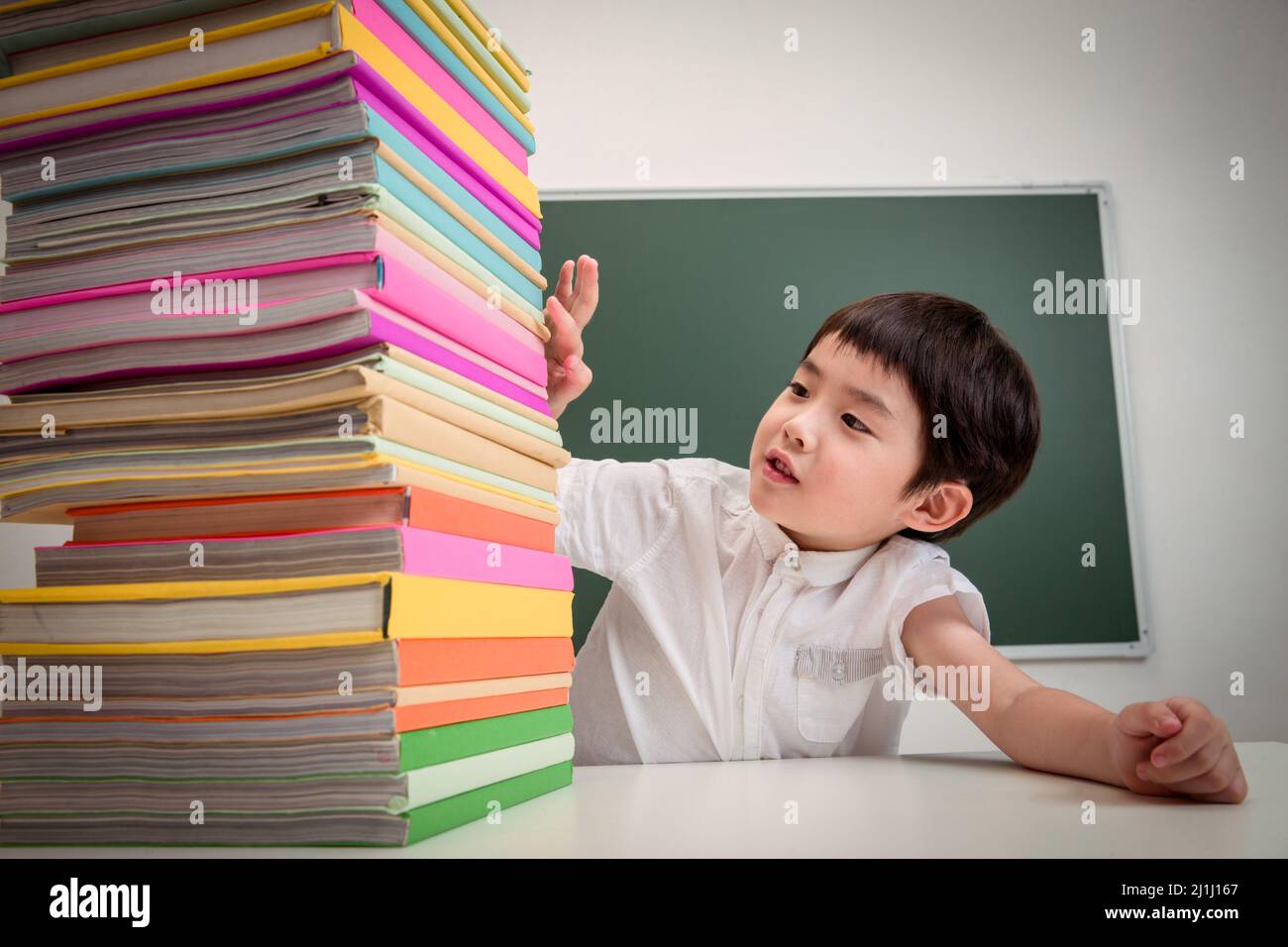Primary school students and textbooks Stock Photo - Alamy