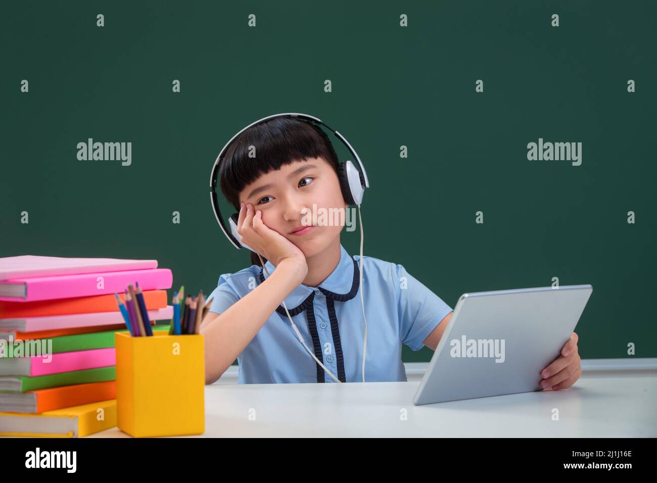 Primary school girls online learning Stock Photo - Alamy