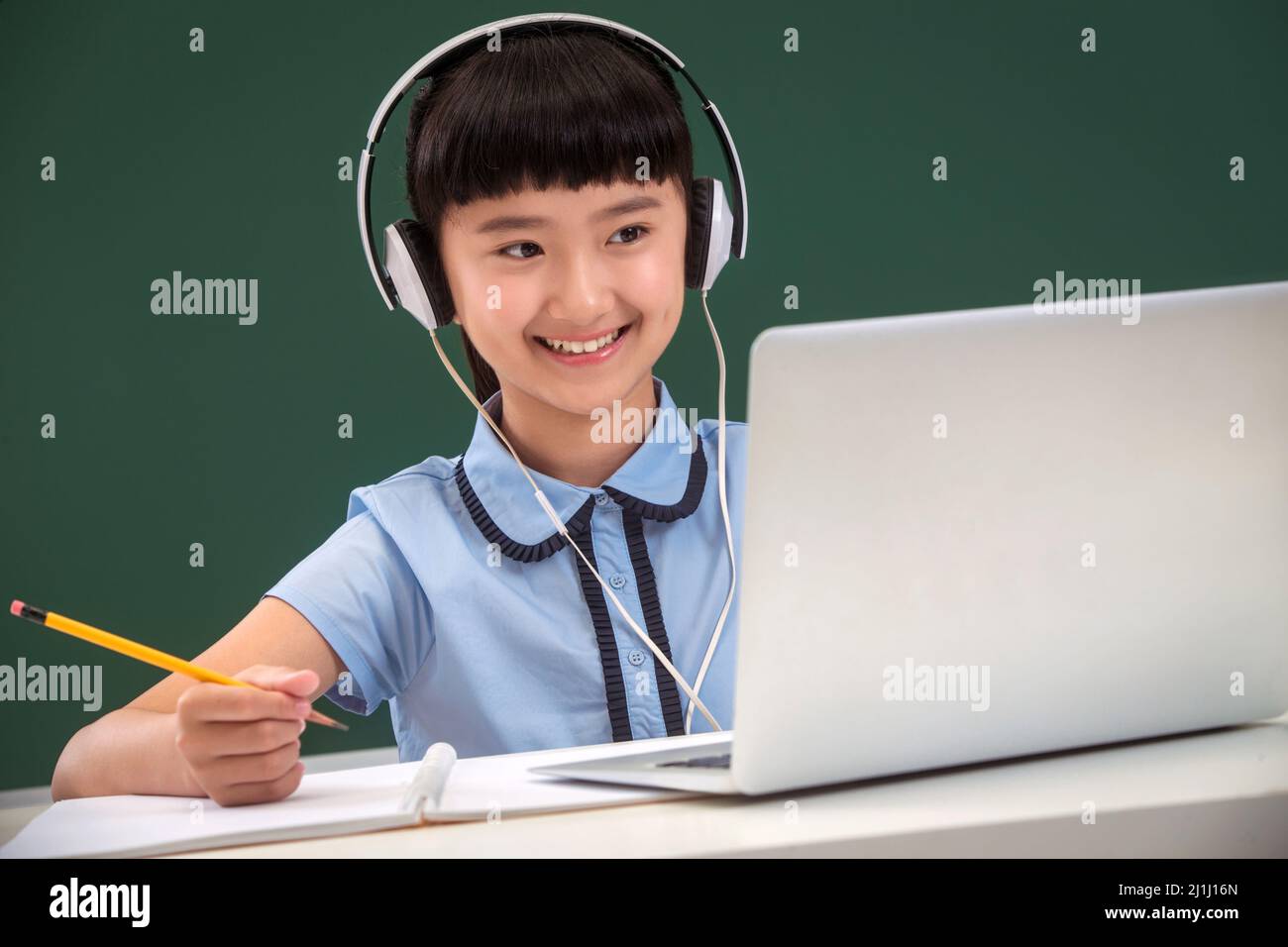 Primary school girls online learning Stock Photo - Alamy