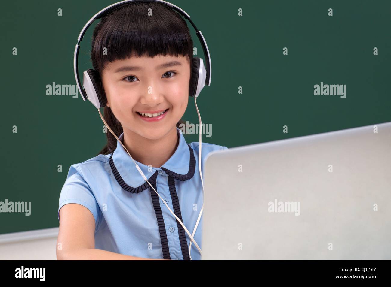 Primary school girls online learning Stock Photo - Alamy