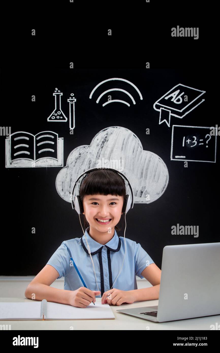 Primary school girls online learning Stock Photo - Alamy
