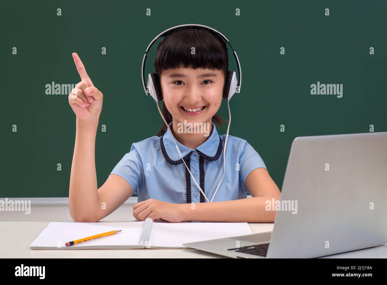 Primary school girls online learning Stock Photo - Alamy