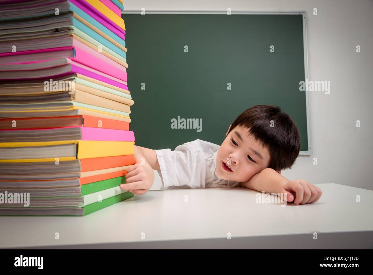 Primary school students and textbooks Stock Photo - Alamy