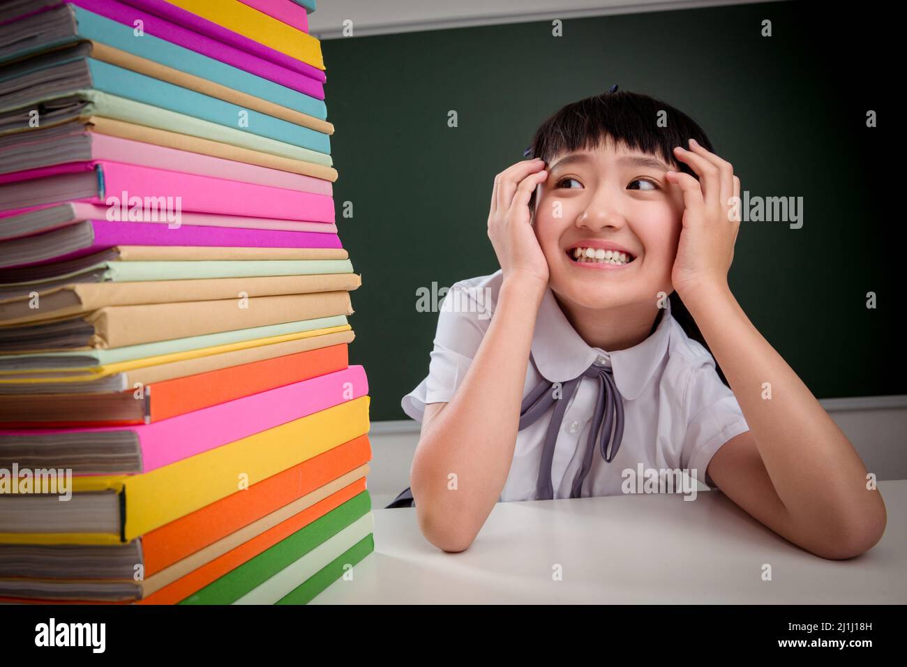 Primary school girls and textbooks Stock Photo - Alamy