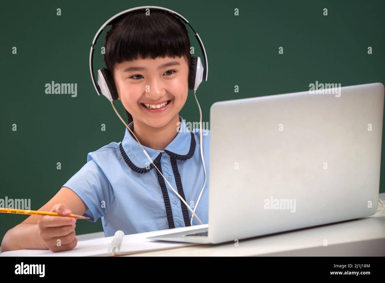 Primary school girls online learning Stock Photo - Alamy