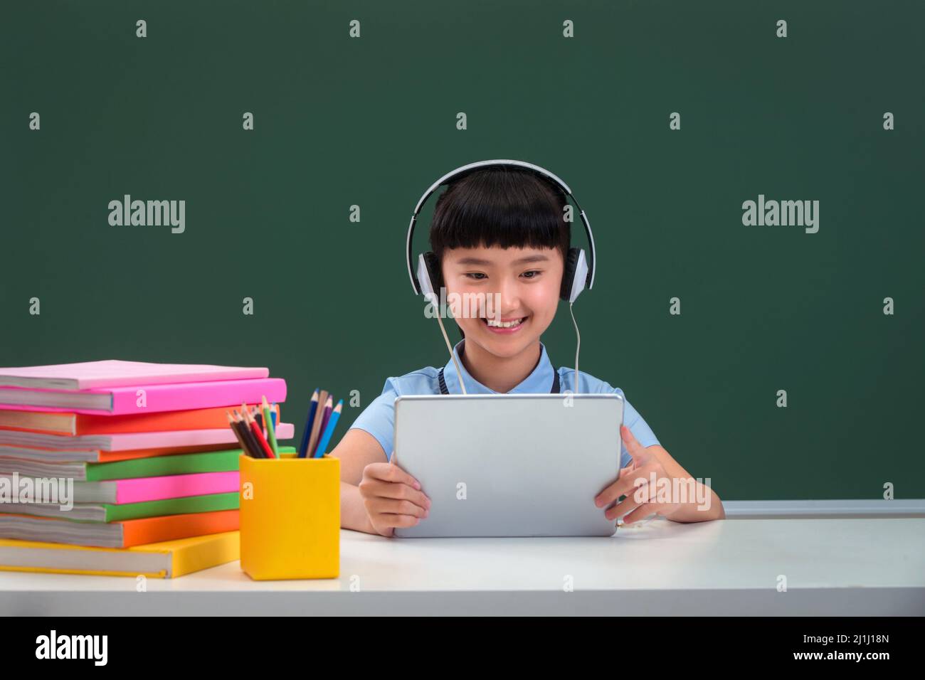 Primary school girls online learning Stock Photo - Alamy