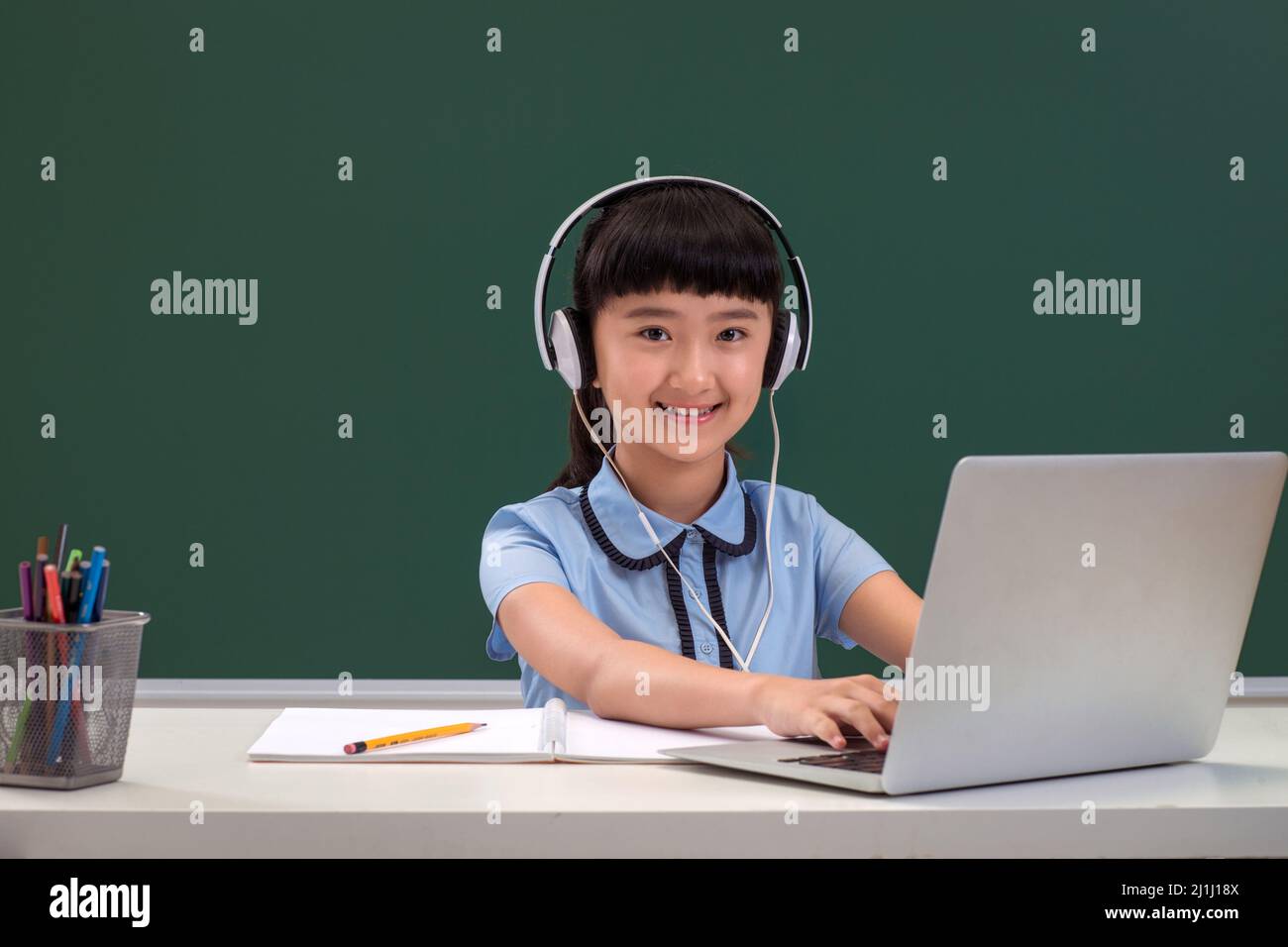 Primary school girls online learning Stock Photo - Alamy