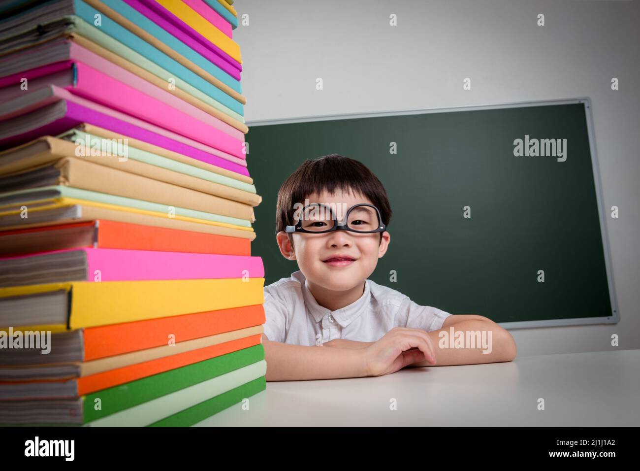 Primary school students and textbooks Stock Photo - Alamy