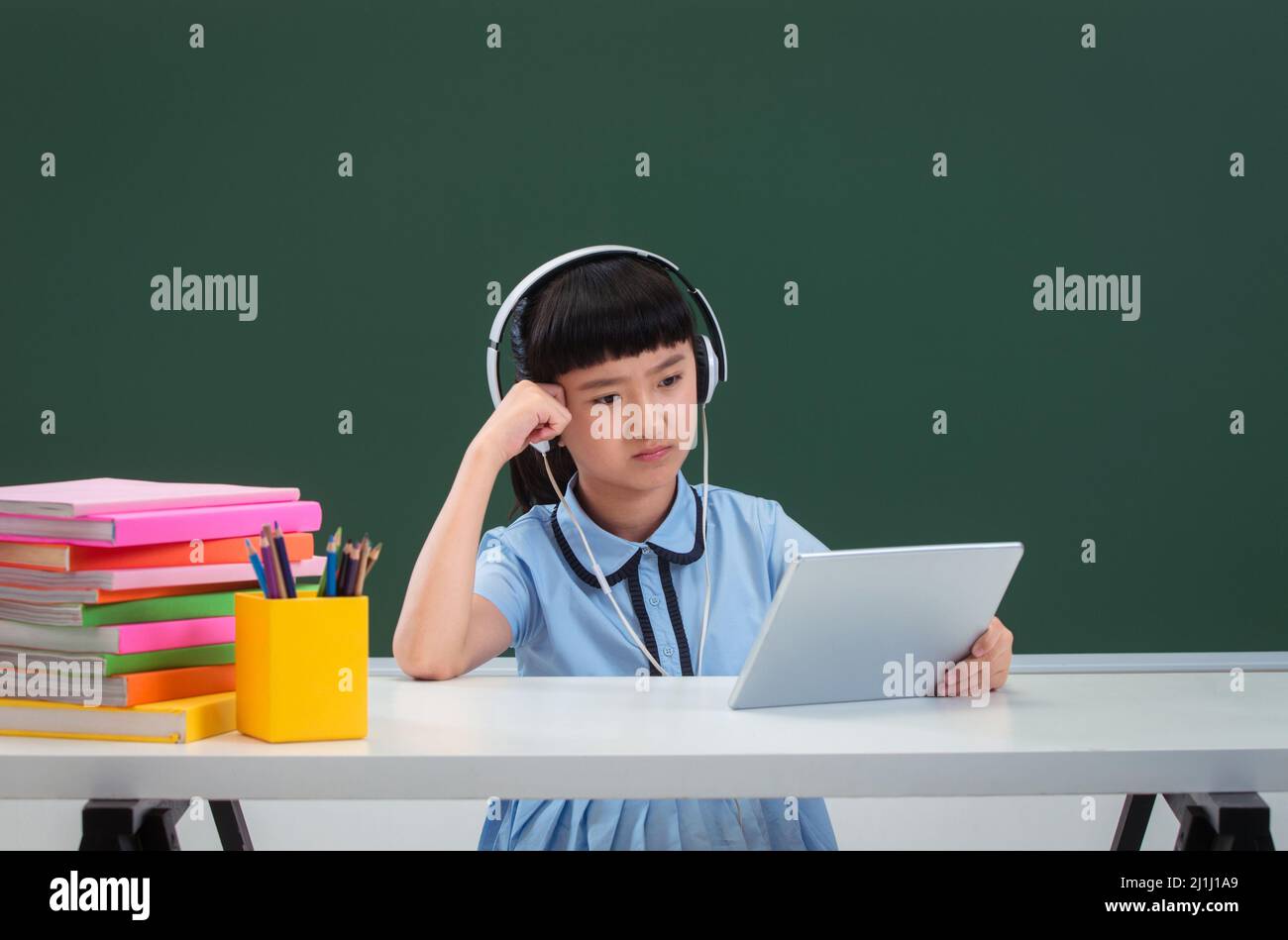 Primary school girls online learning Stock Photo - Alamy
