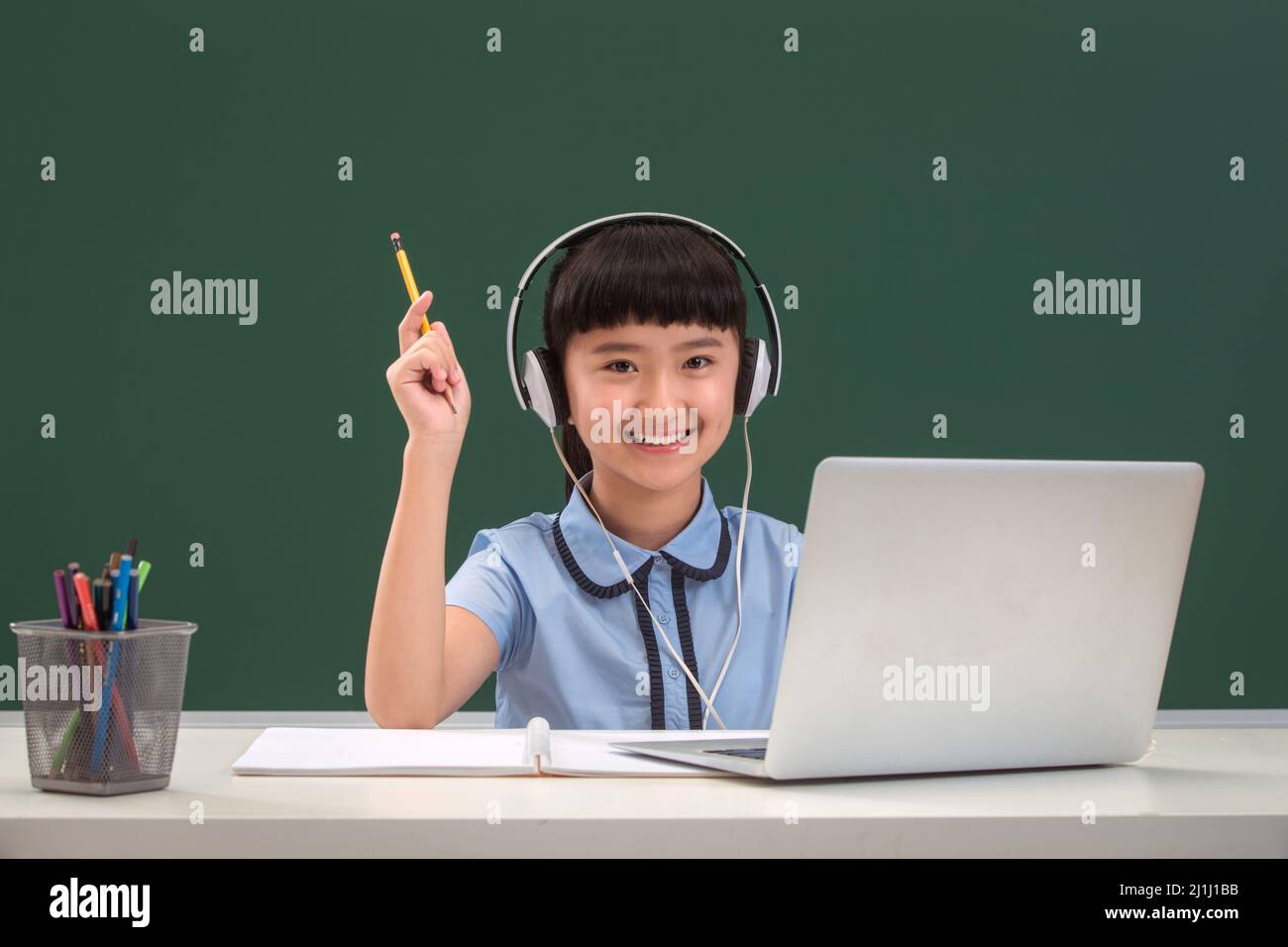 Primary school girls online learning Stock Photo - Alamy