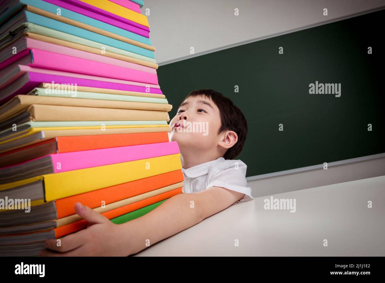 Primary school students and textbooks Stock Photo - Alamy