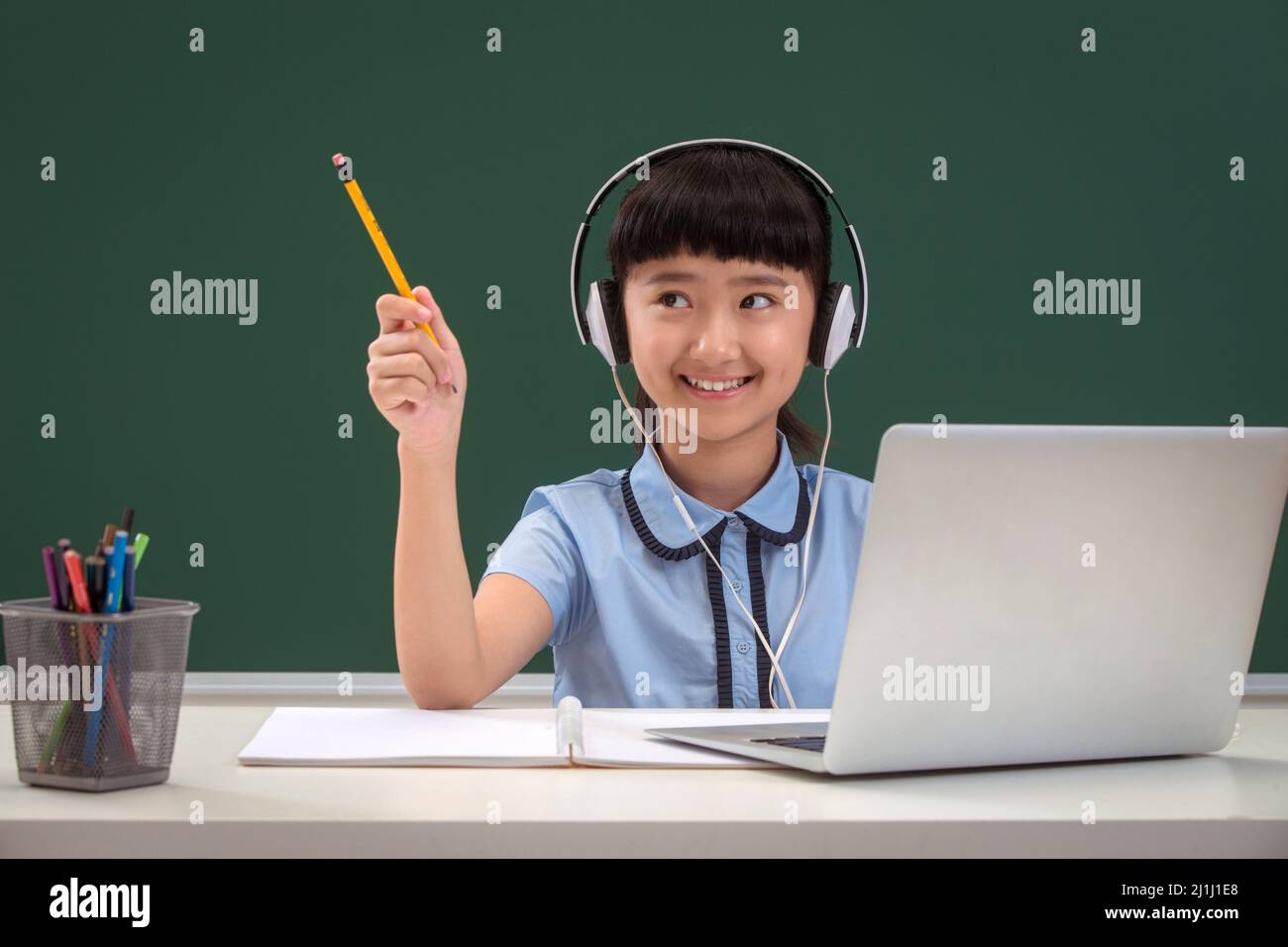 Primary school girls online learning Stock Photo - Alamy