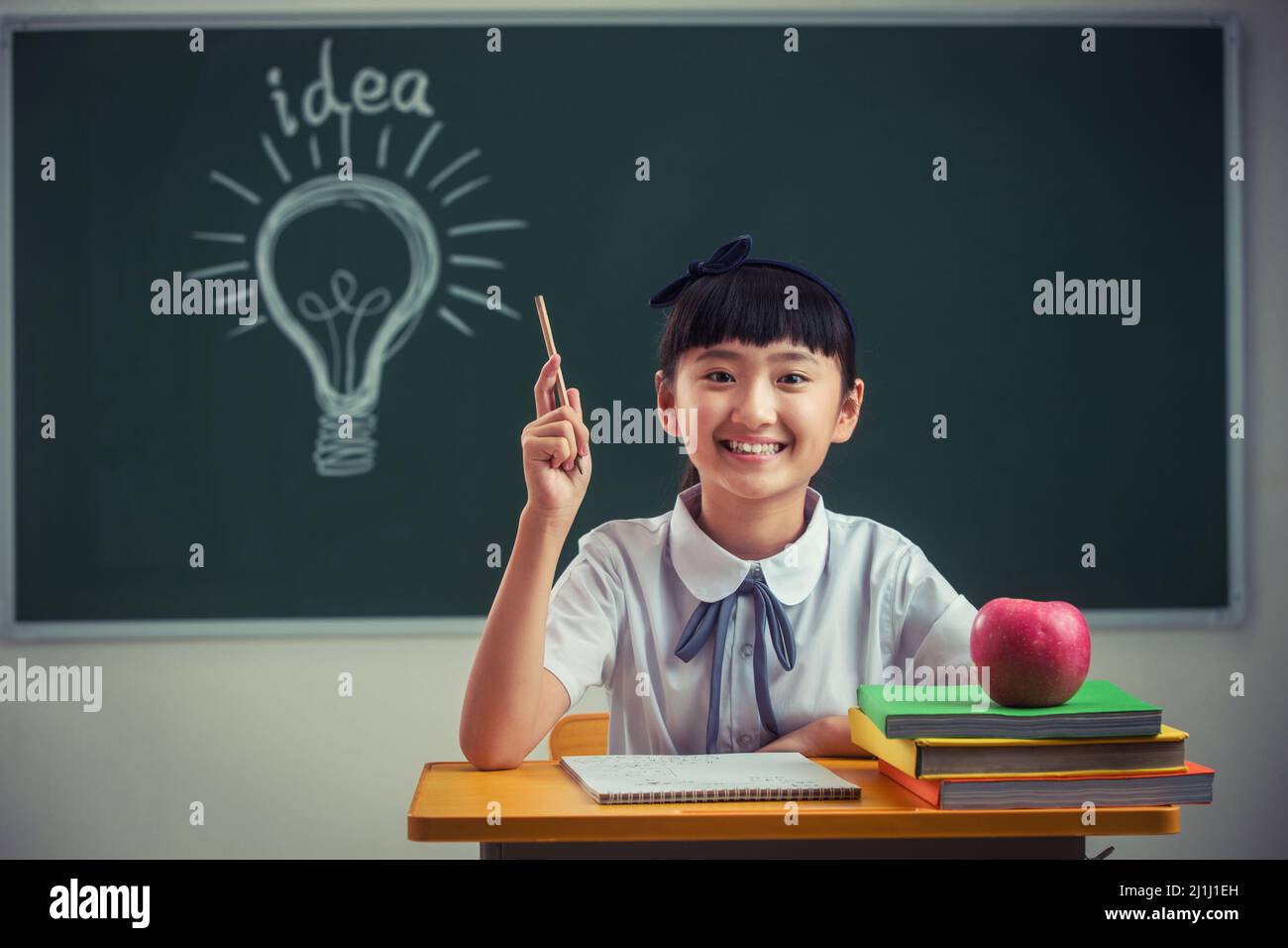 Primary school girls in the classroom Stock Photo - Alamy
