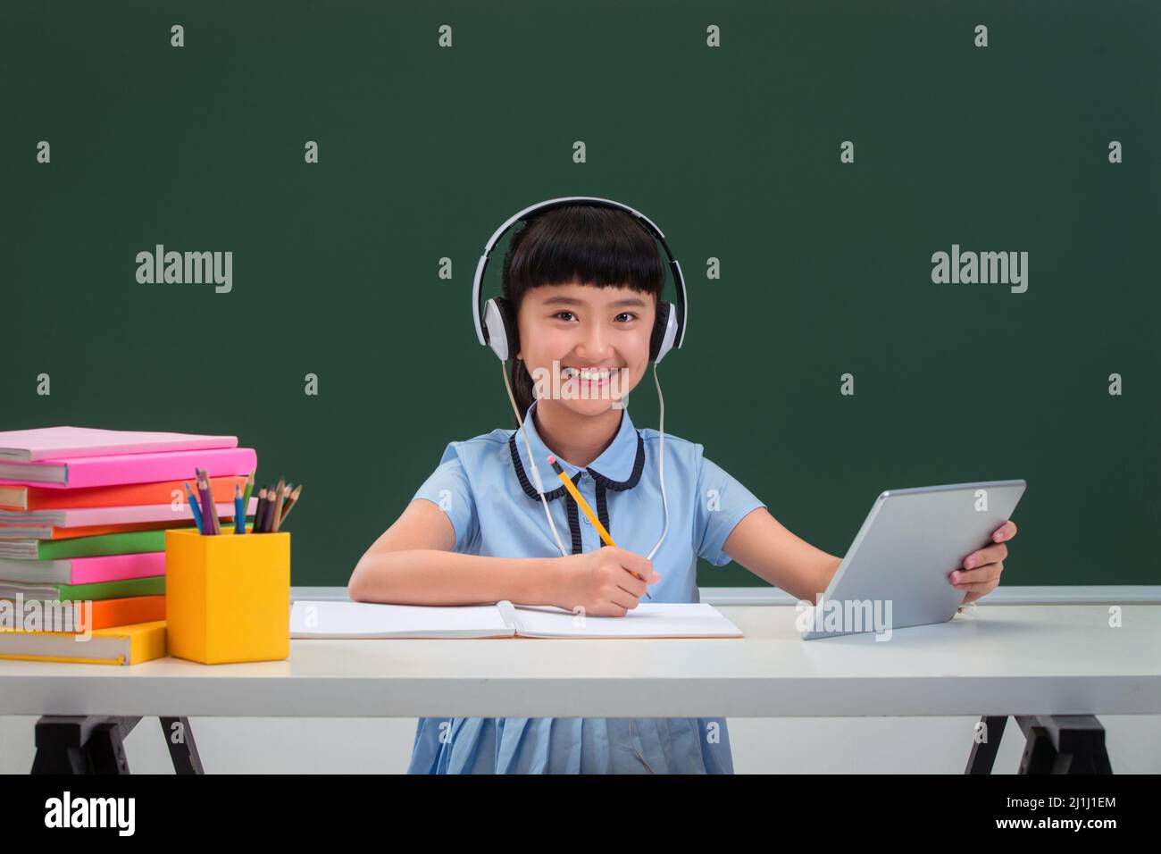Primary school girls online learning Stock Photo - Alamy
