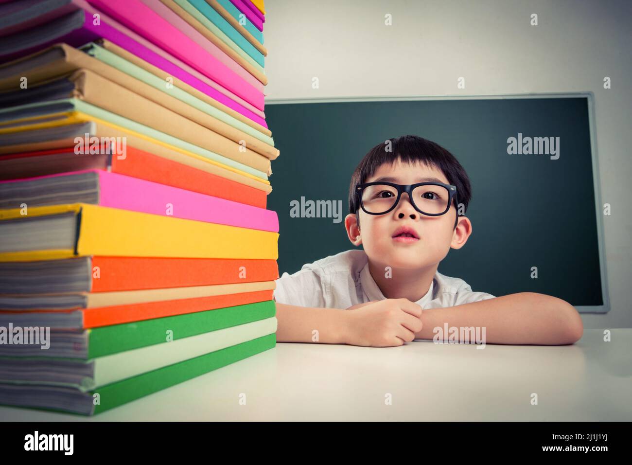 Primary school students and textbooks Stock Photo - Alamy