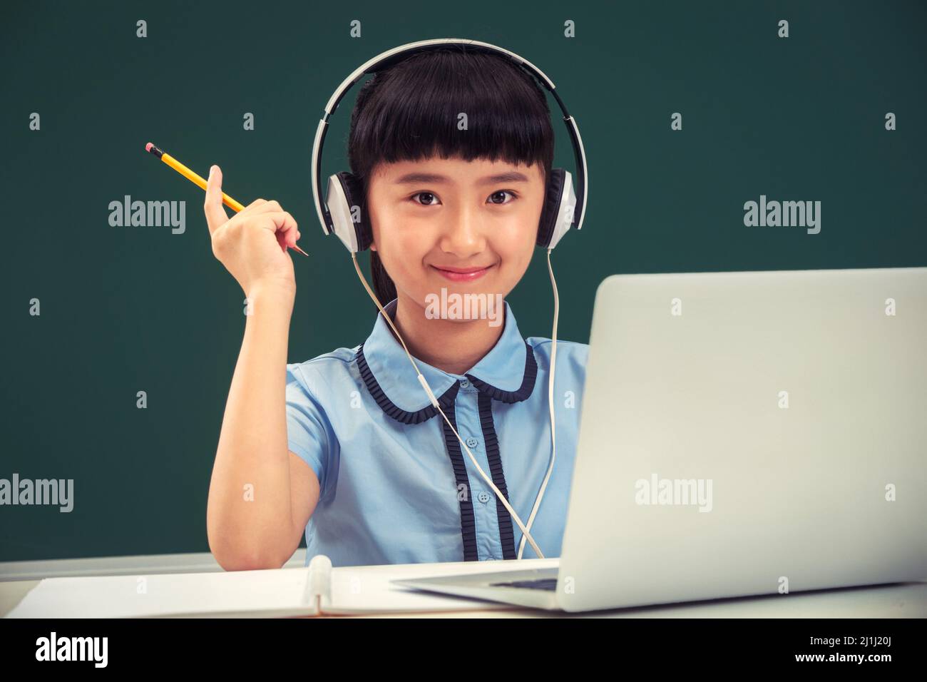 Primary school girls online learning Stock Photo - Alamy