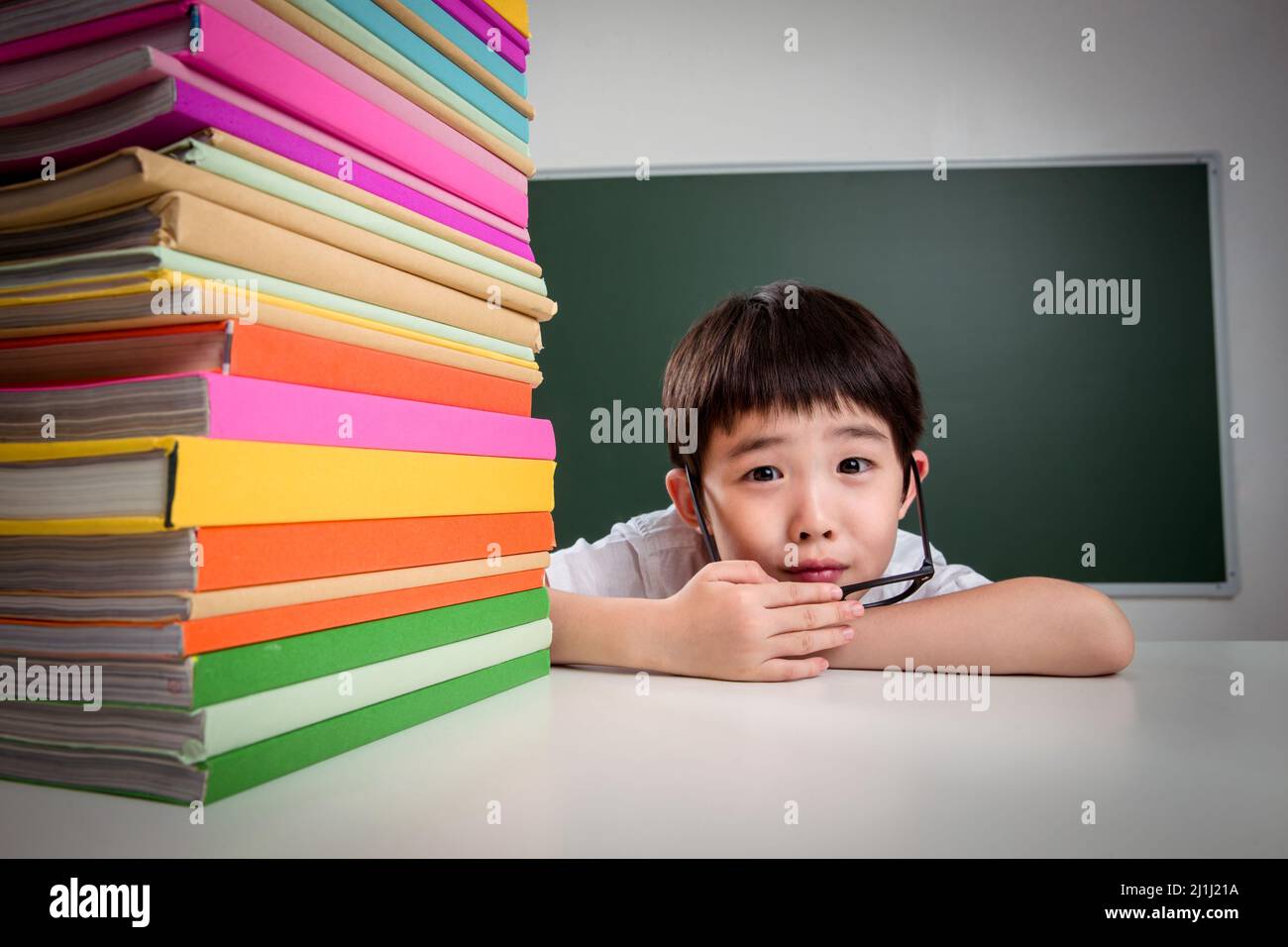 Primary school students and textbooks Stock Photo - Alamy