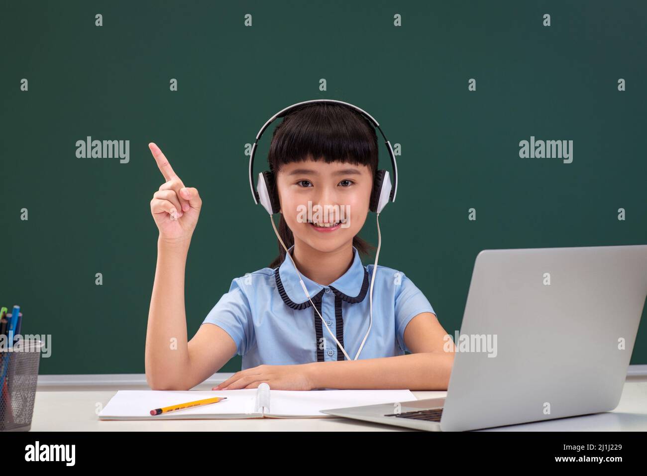 Primary school girls online learning Stock Photo - Alamy