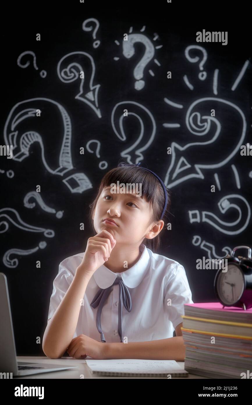 Indian school girl student thinking hi-res stock photography and images ...