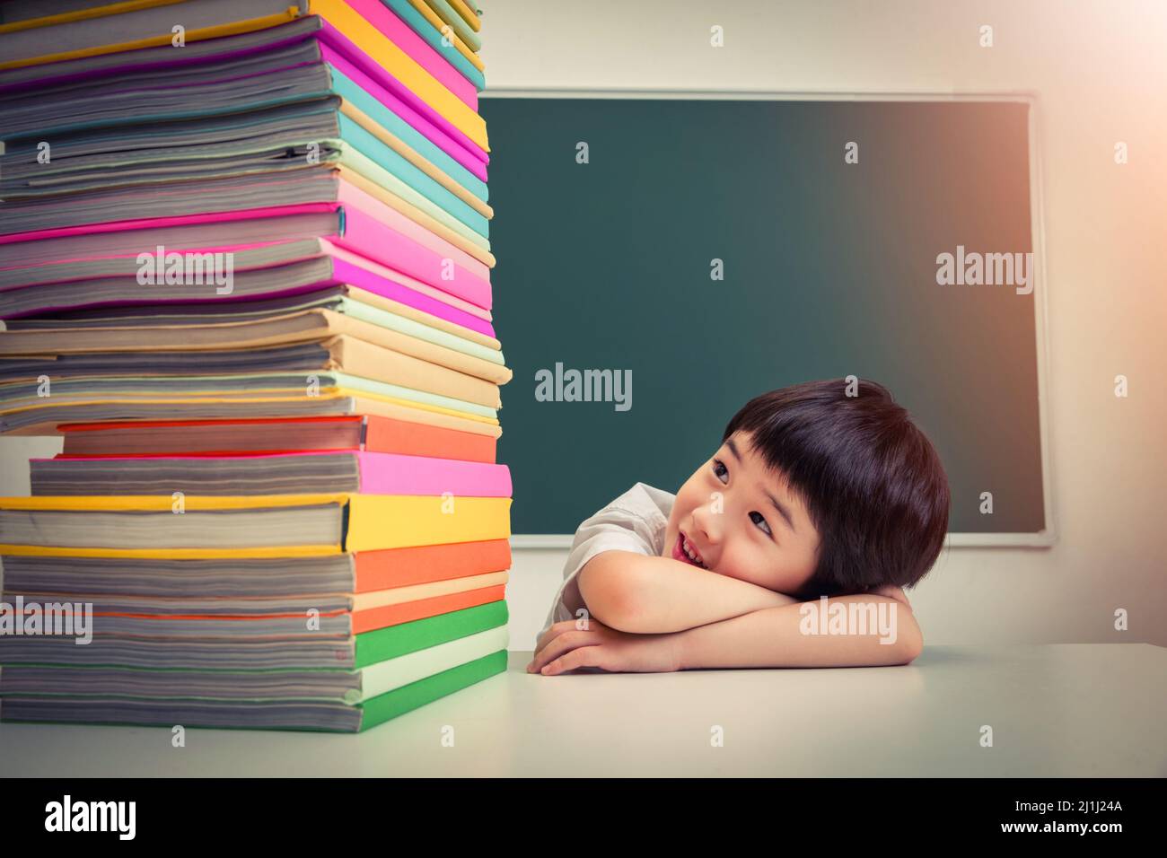 Primary school students and textbooks Stock Photo - Alamy
