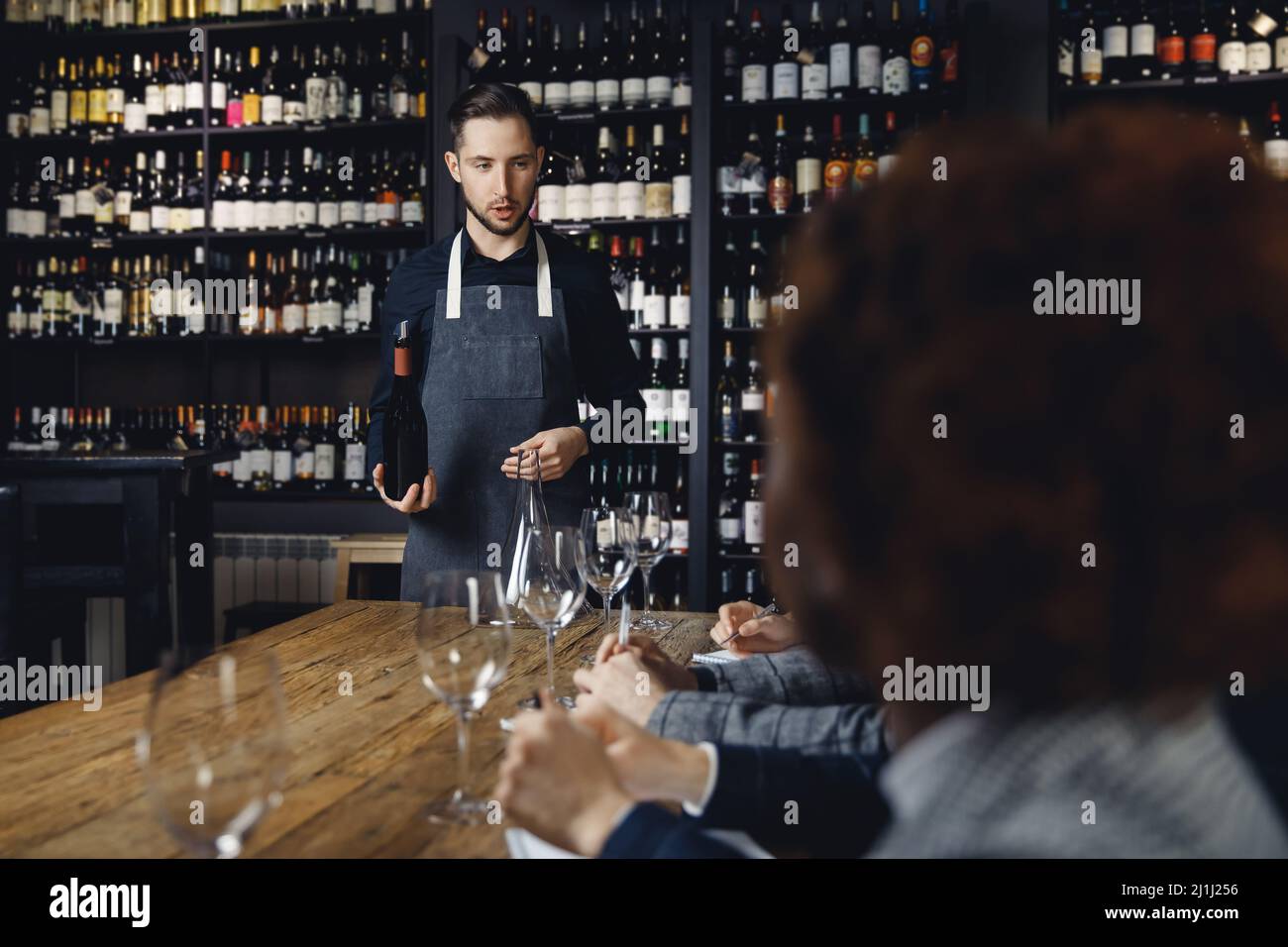 Man and woman with red wine tasting in wine cellar hi-res stock ...