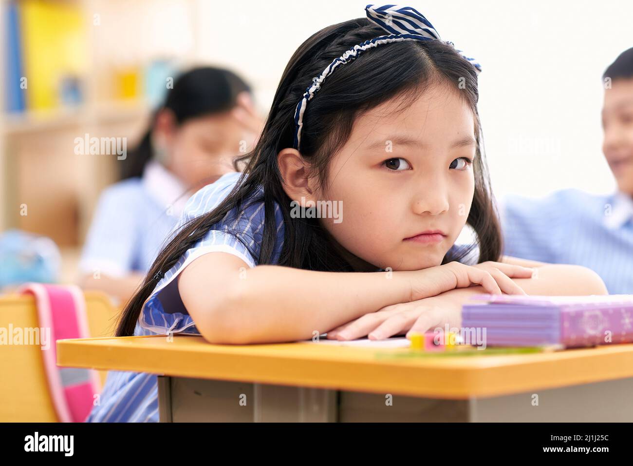 Primary school girls in the classroom Stock Photo - Alamy