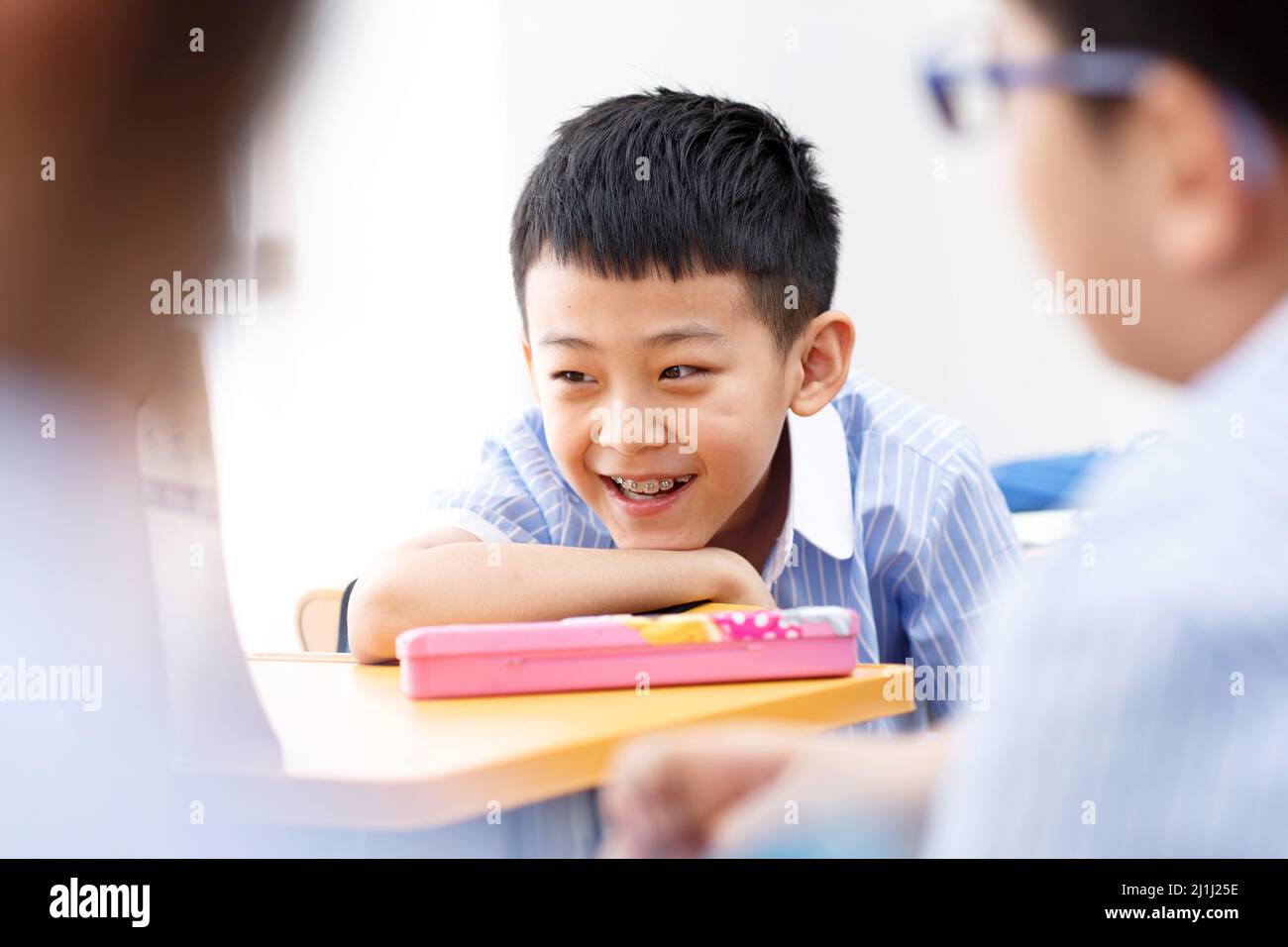 Primary school boy in the classroom Stock Photo - Alamy