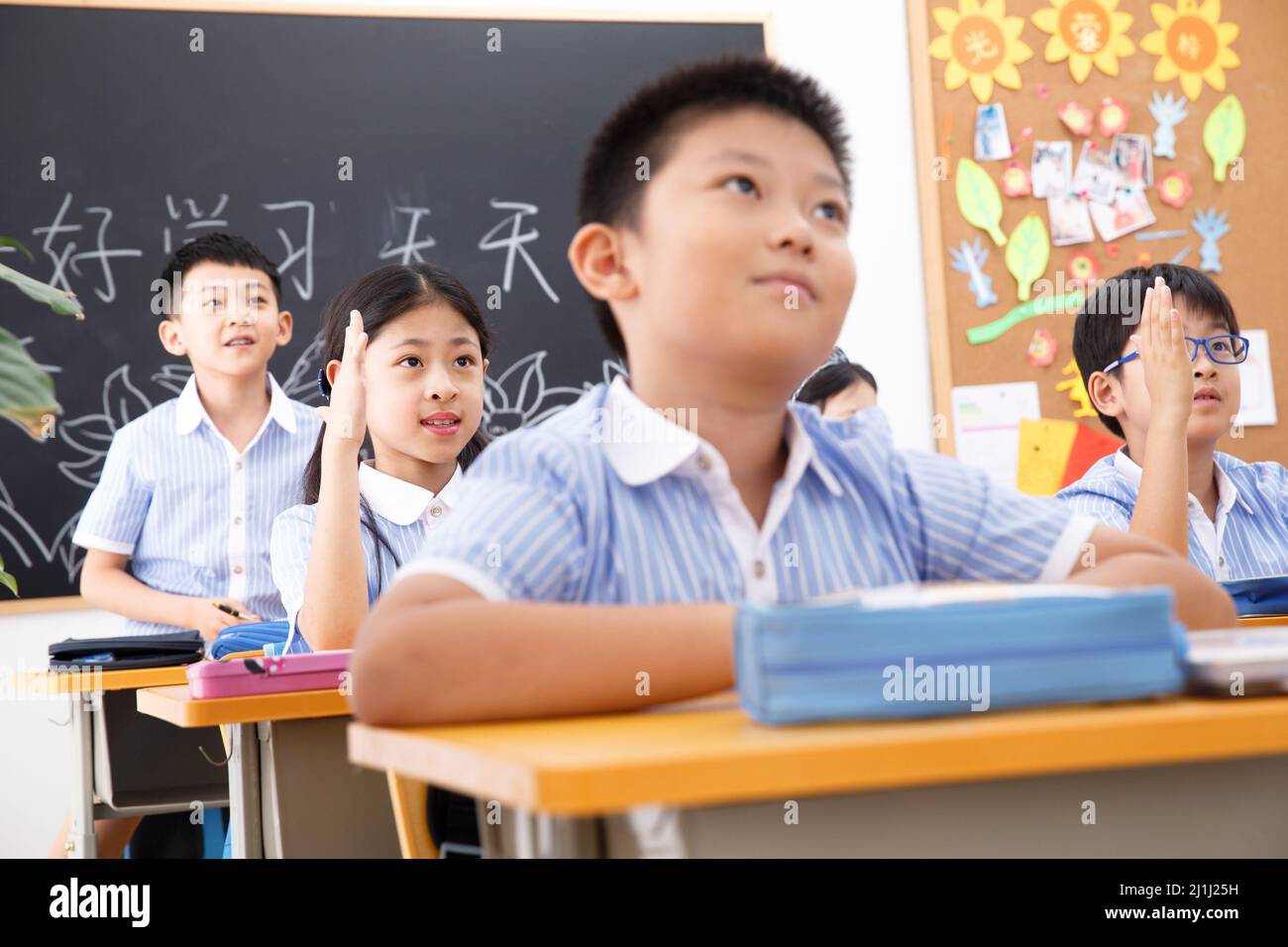 Elementary school students in the classroom Stock Photo - Alamy