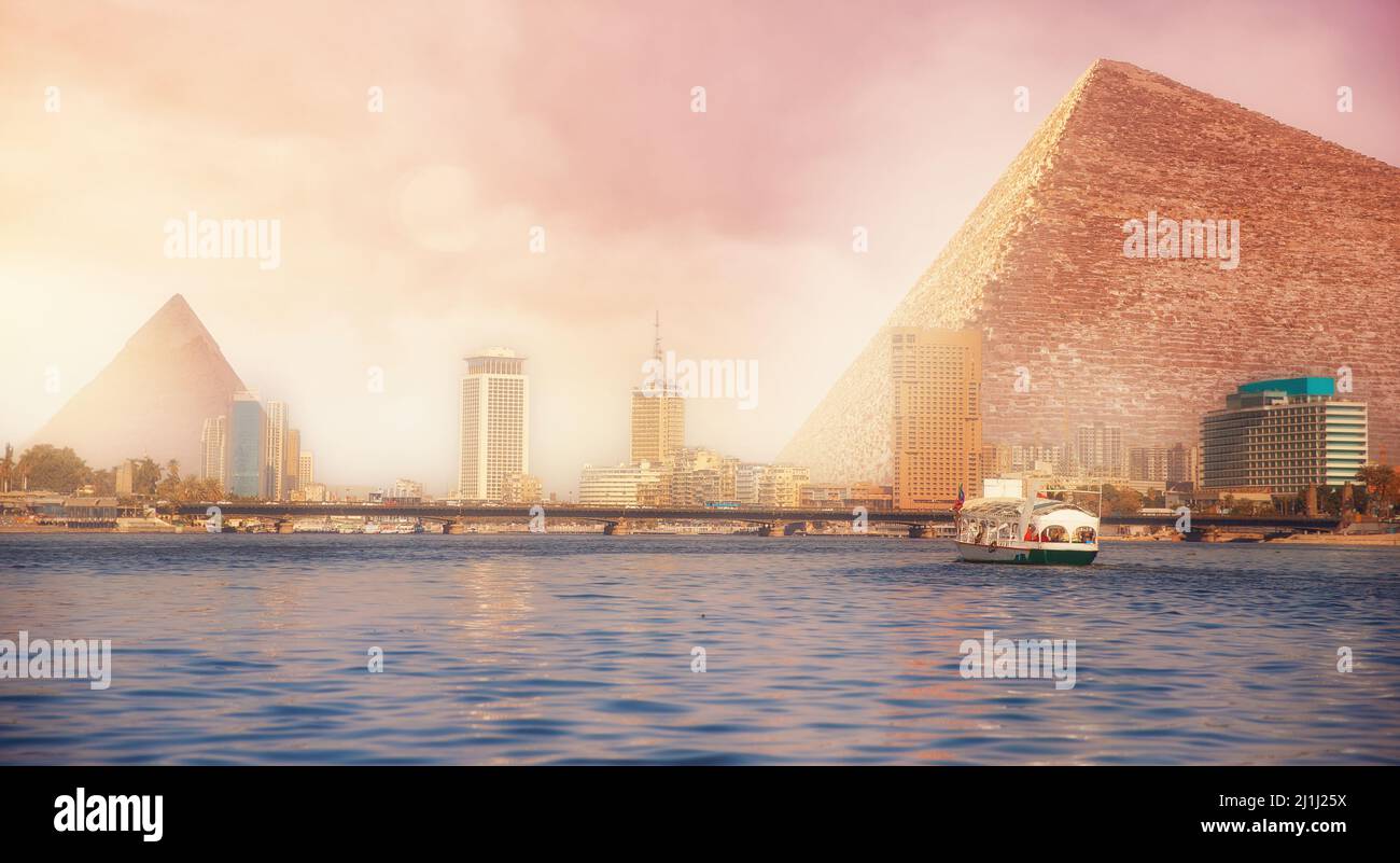 Sunset river Nile with boat yacht background egyptian pyramid Cairo ...