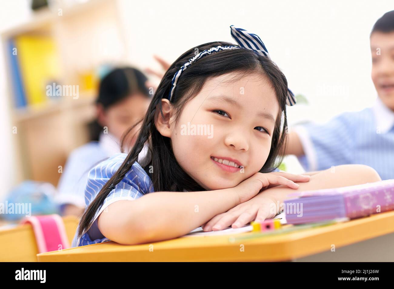Primary school girls in the classroom Stock Photo - Alamy