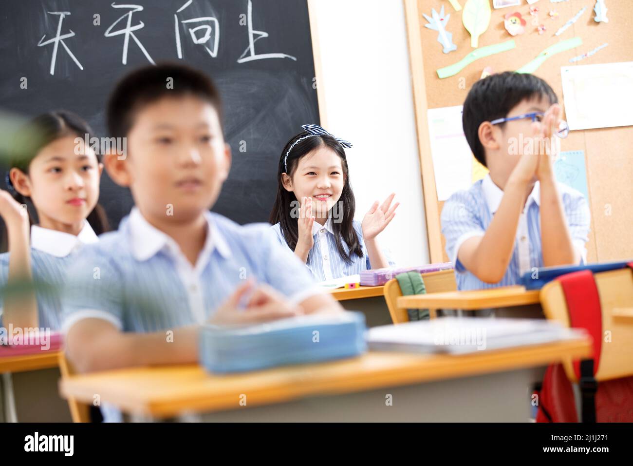 Elementary school students in the classroom Stock Photo - Alamy