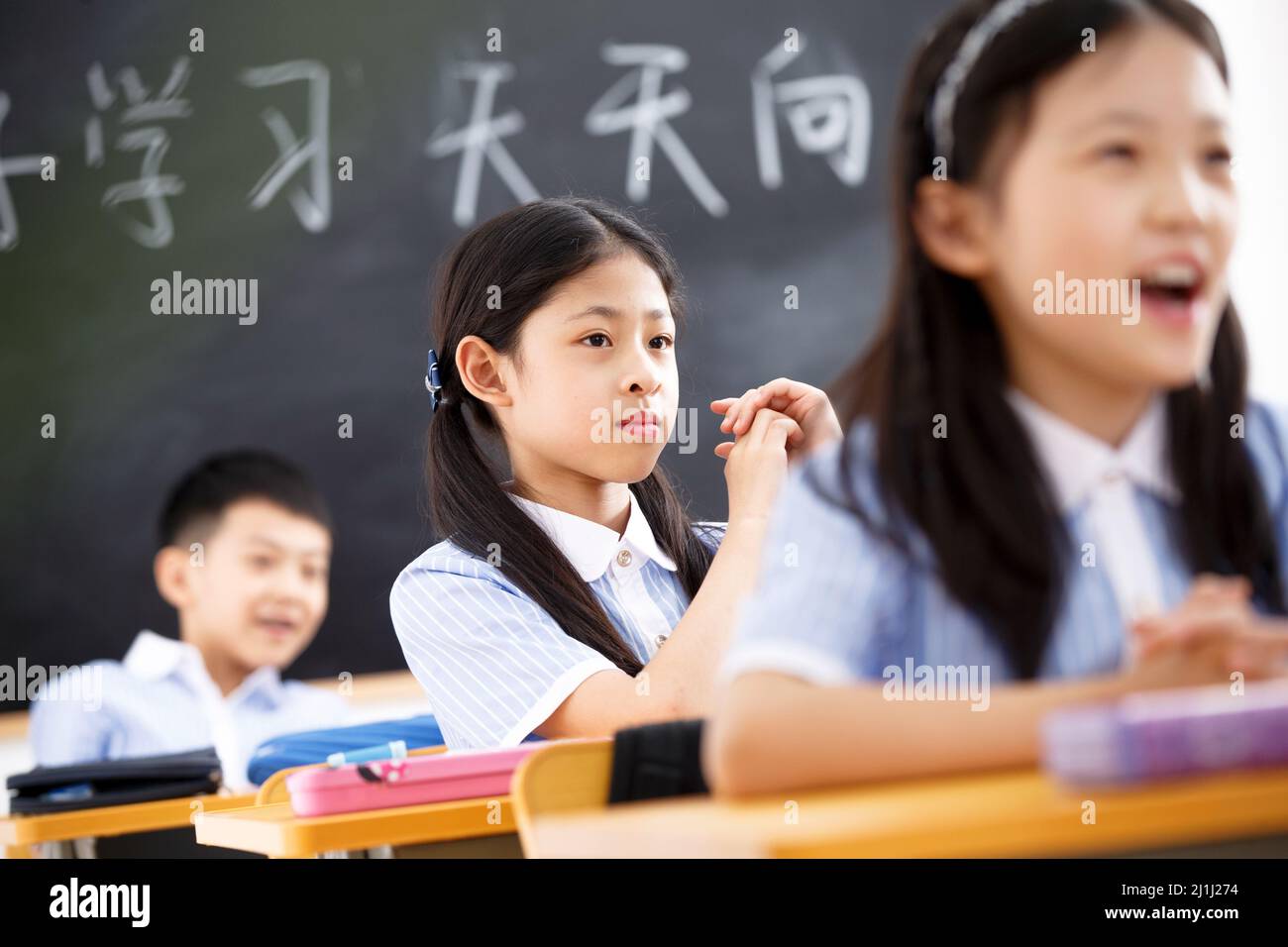 Elementary school students in the classroom Stock Photo - Alamy