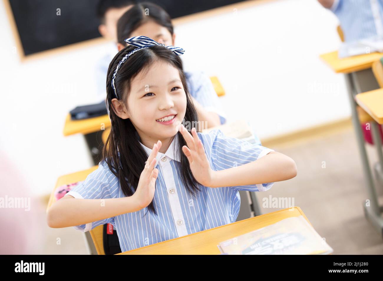 Primary school girls in the classroom Stock Photo - Alamy