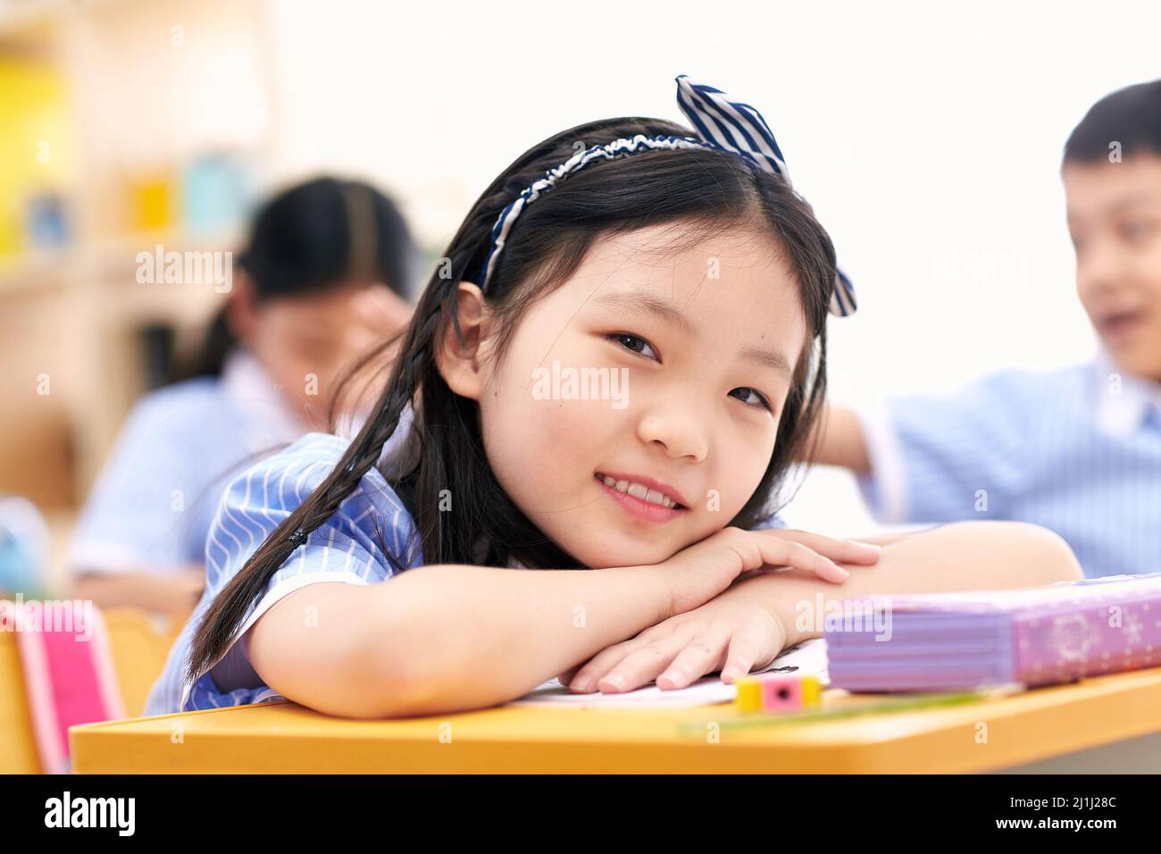 Primary school girls in the classroom Stock Photo - Alamy